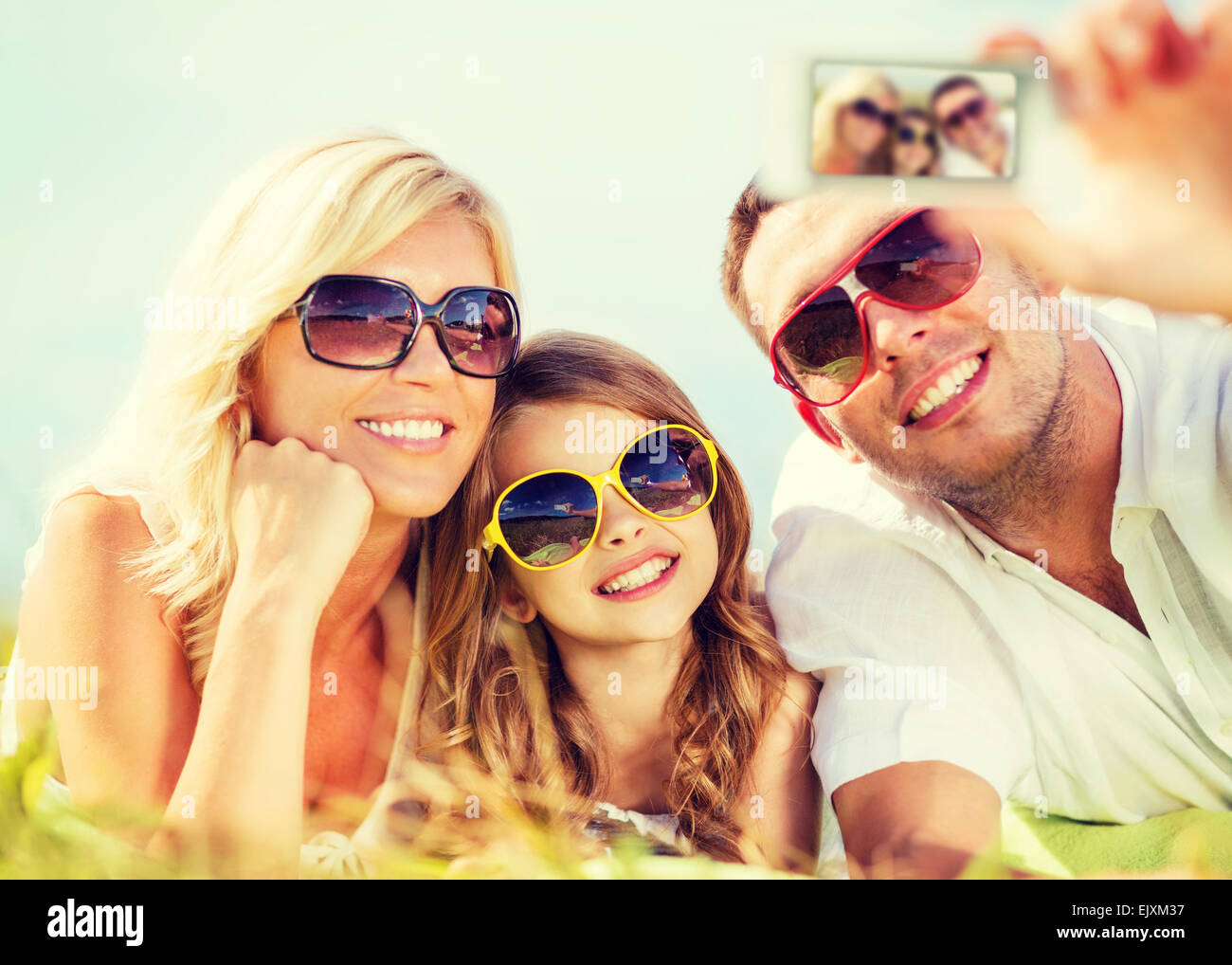happy family with camera taking picture Stock Photo - Alamy