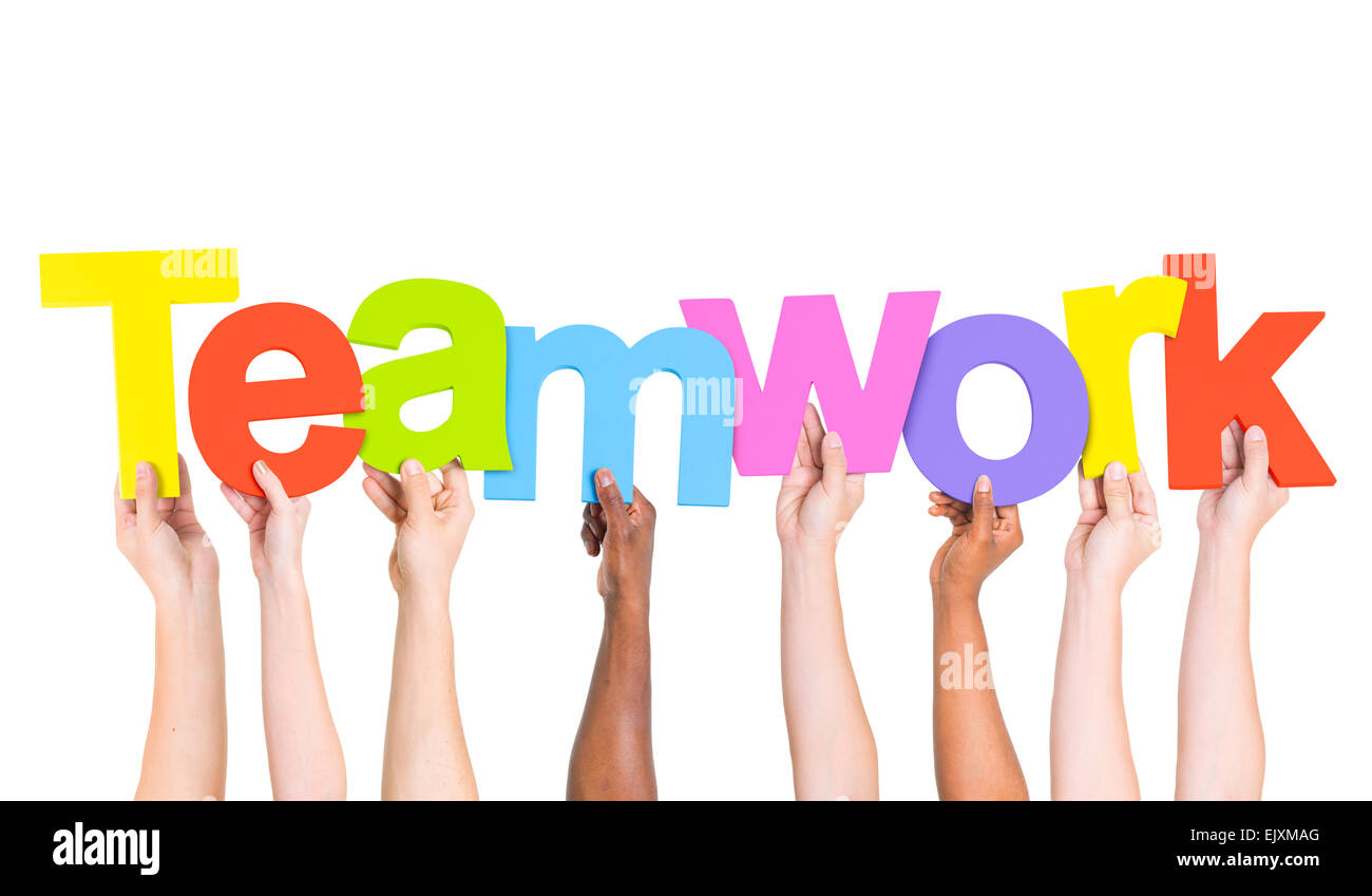 Multi-Ethnic Group Of People Holding The Word Teamwork Stock Photo - Alamy