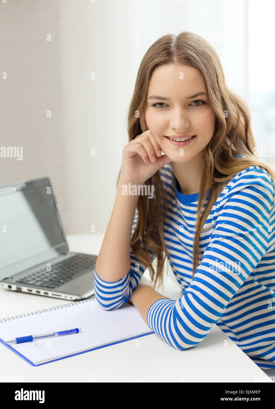 smiling teenage girl laptop computer and notebook Stock Photo - Alamy