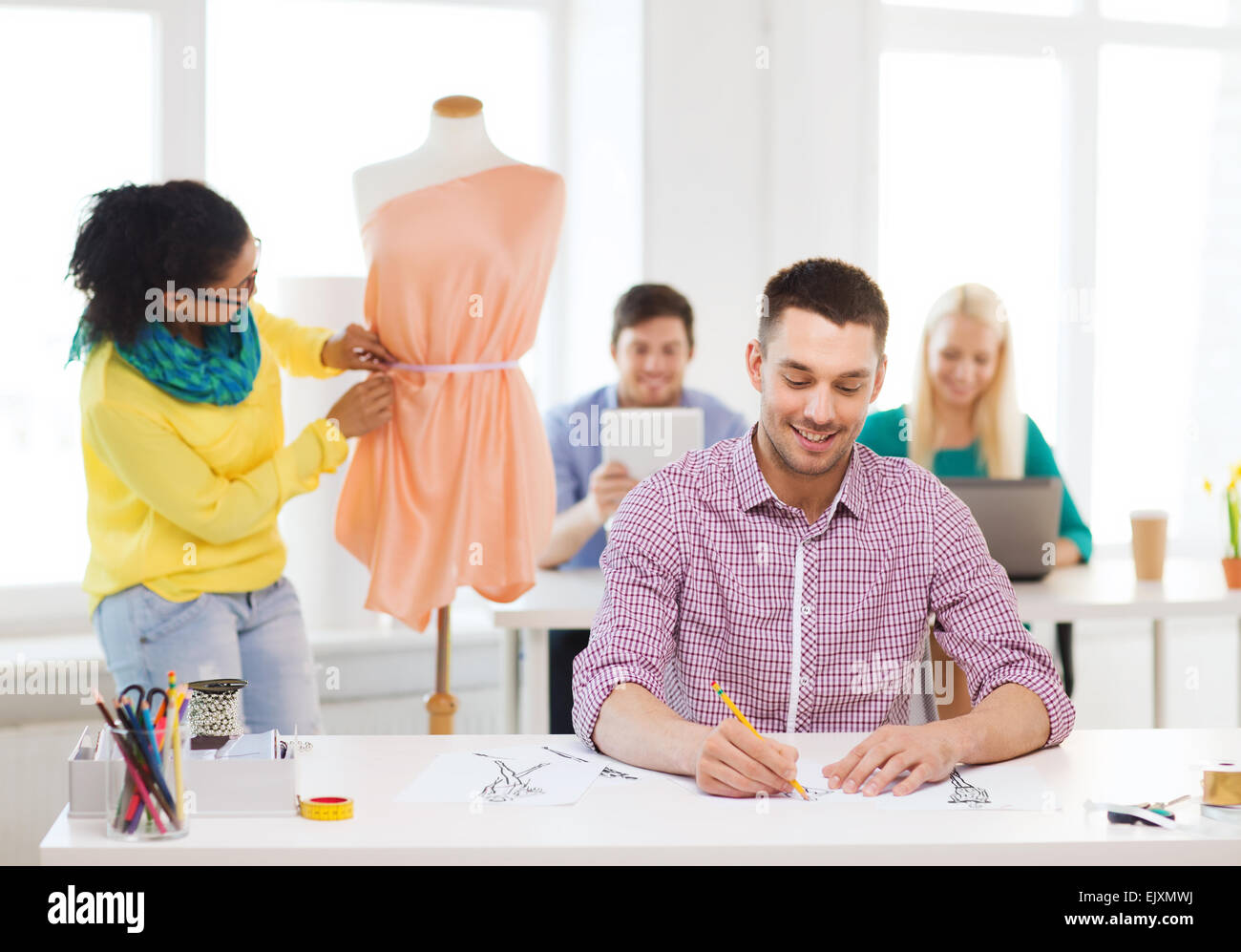 Female fashion designers drawing sketches hi-res stock photography and ...