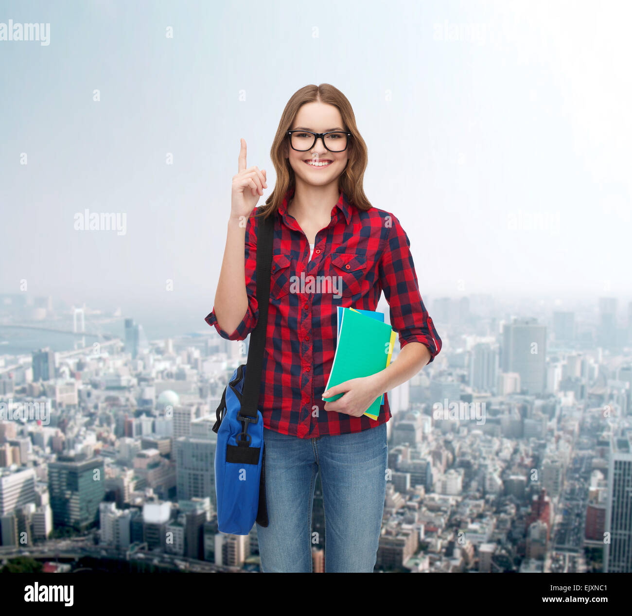 smiling female student with bag and notebooks Stock Photo - Alamy