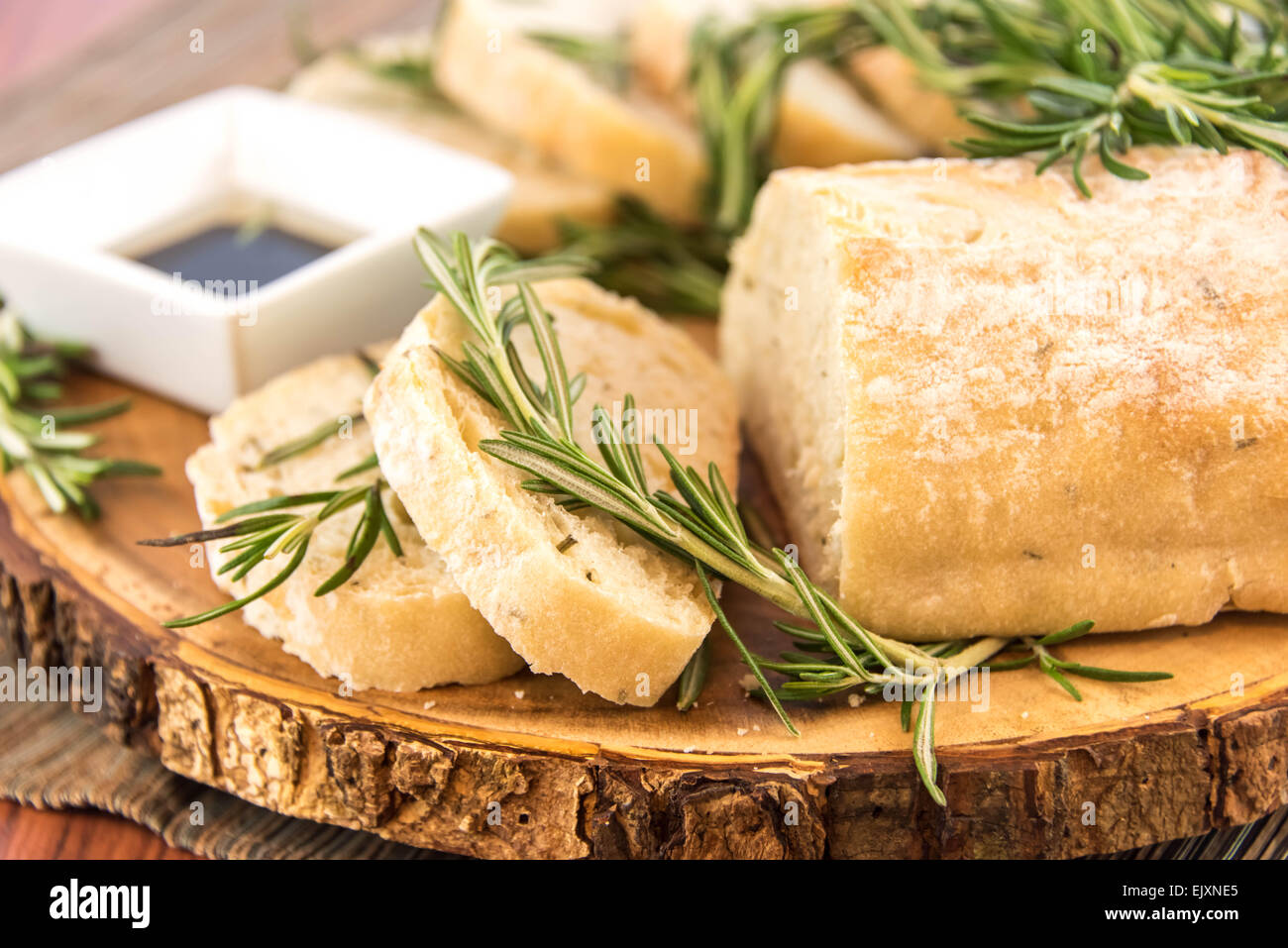 a fresh baked loaf of rosemary bread and olive oil and balsamic vinegar ...