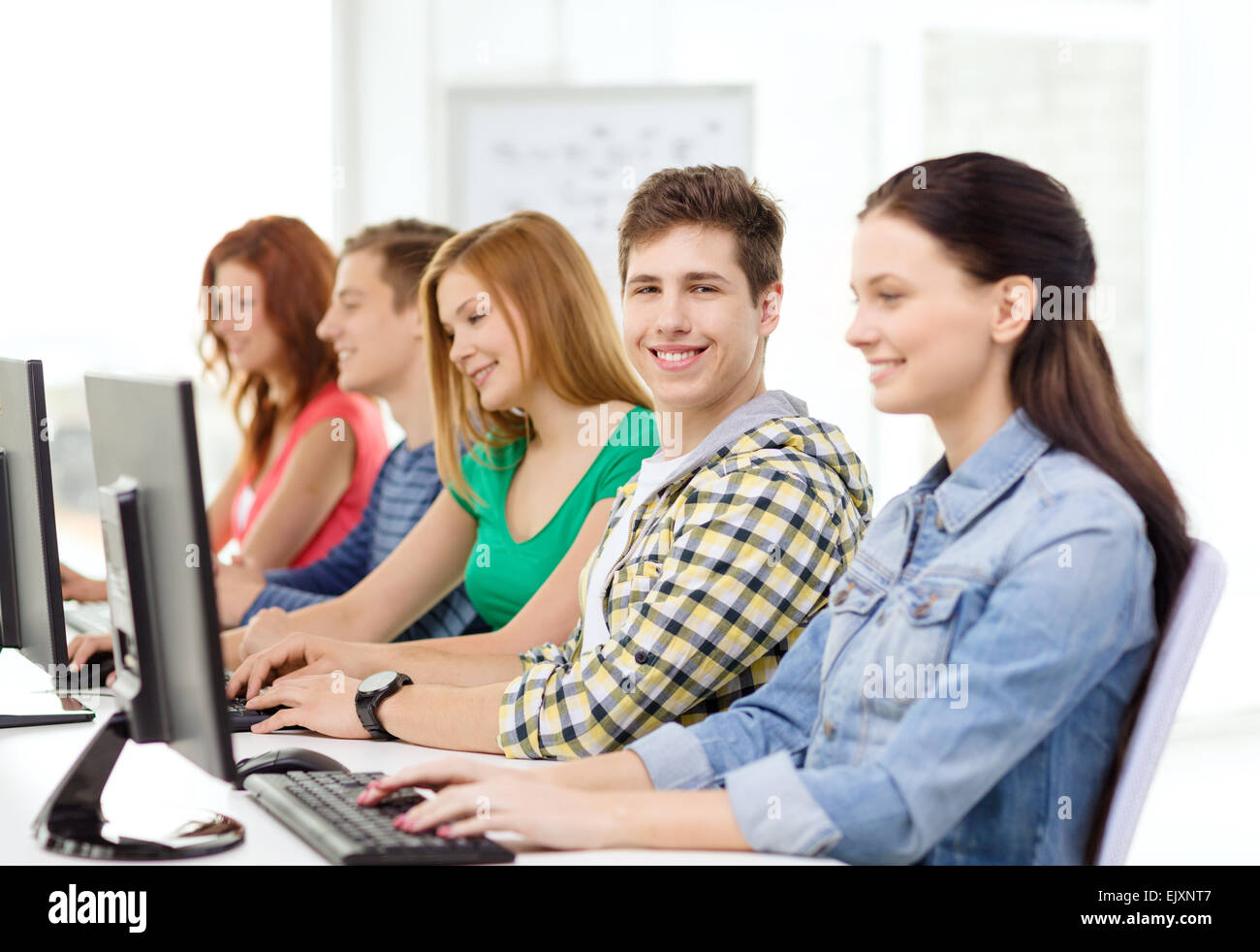 smiling student with computer studying at school Stock Photo - Alamy