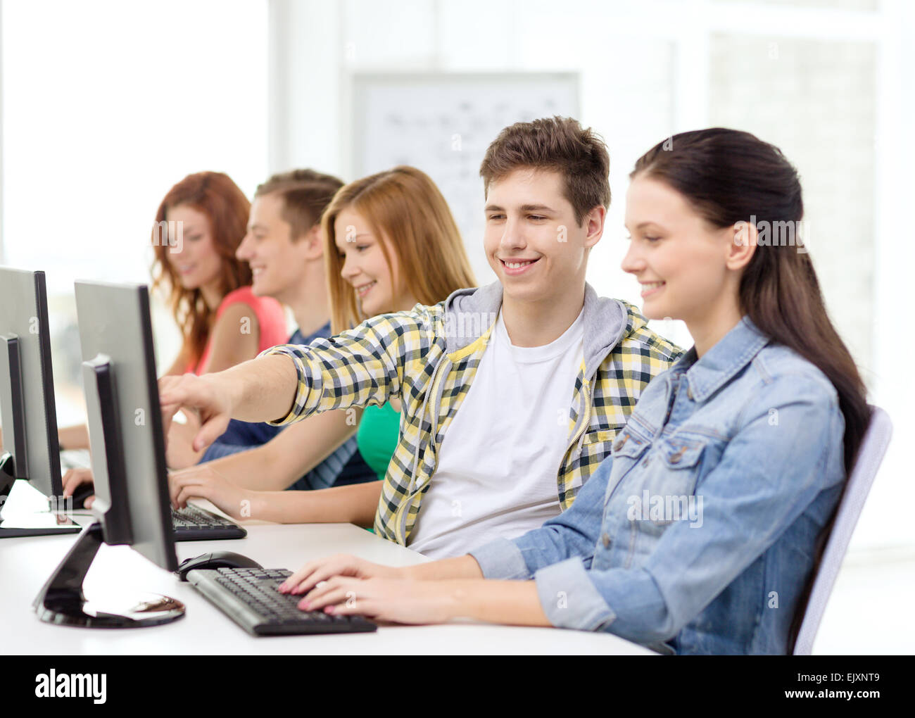 female student with classmates in computer class Stock Photo - Alamy