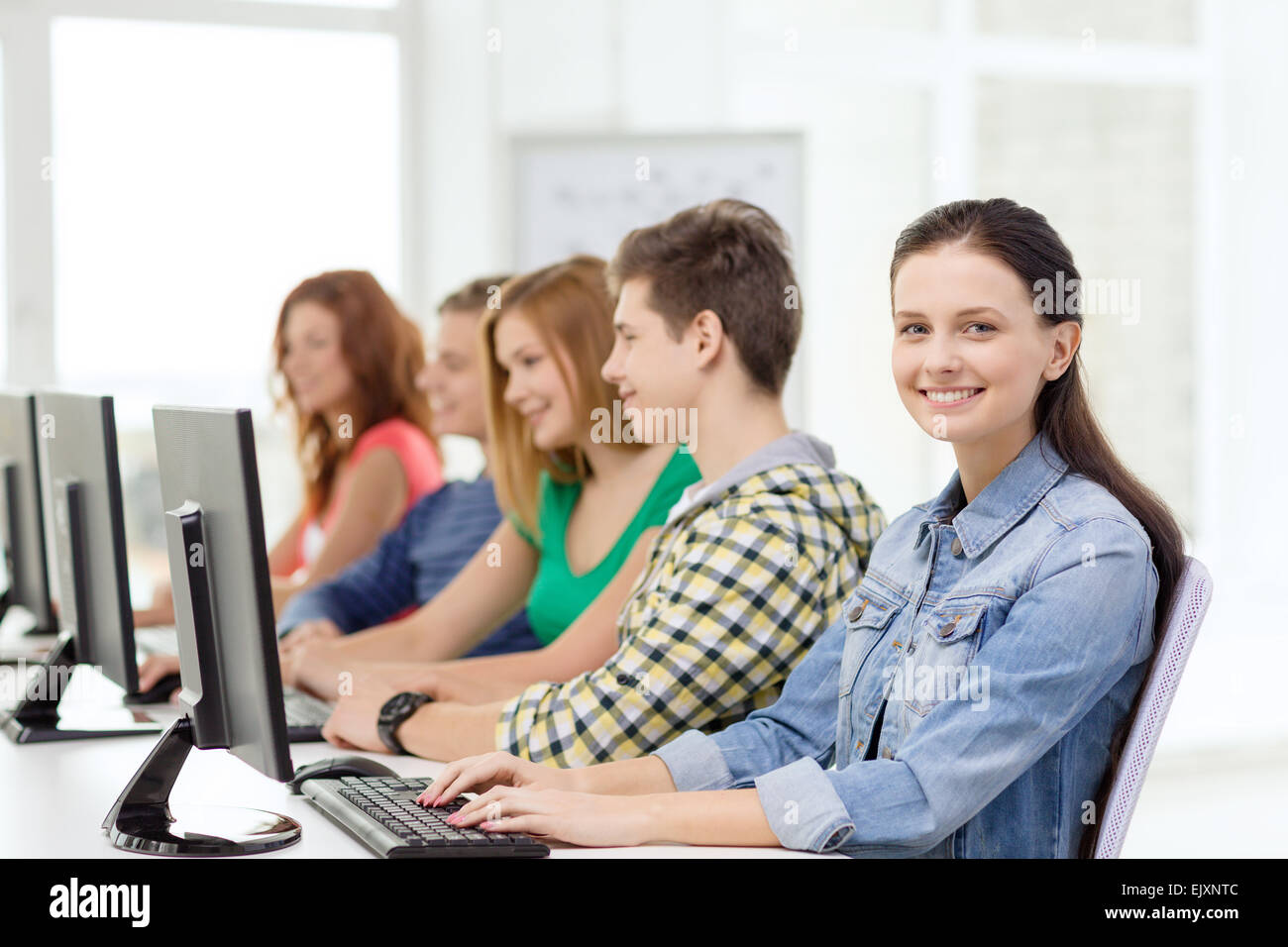 female student with classmates in computer class Stock Photo - Alamy