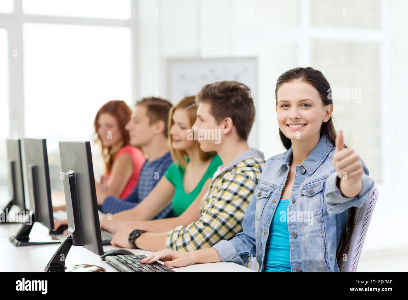 female student with classmates in computer class Stock Photo - Alamy
