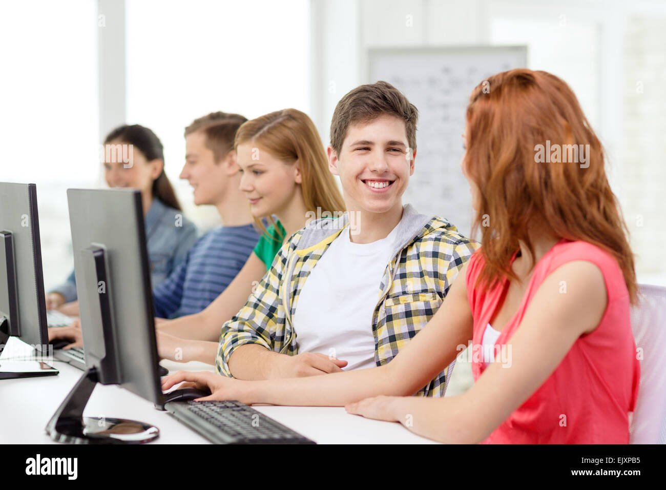 smiling students in computer class at school Stock Photo - Alamy