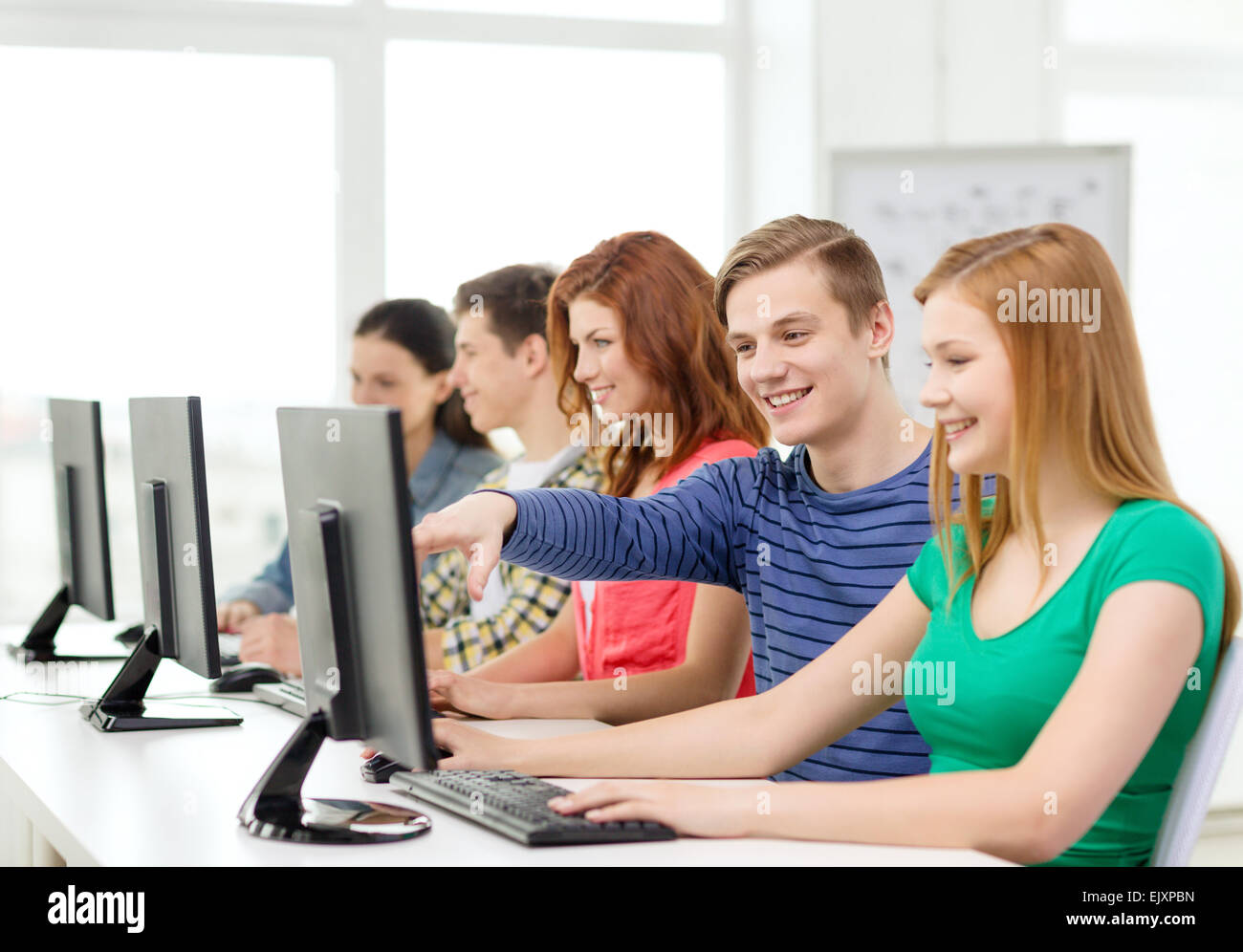 female student with classmates in computer class Stock Photo - Alamy