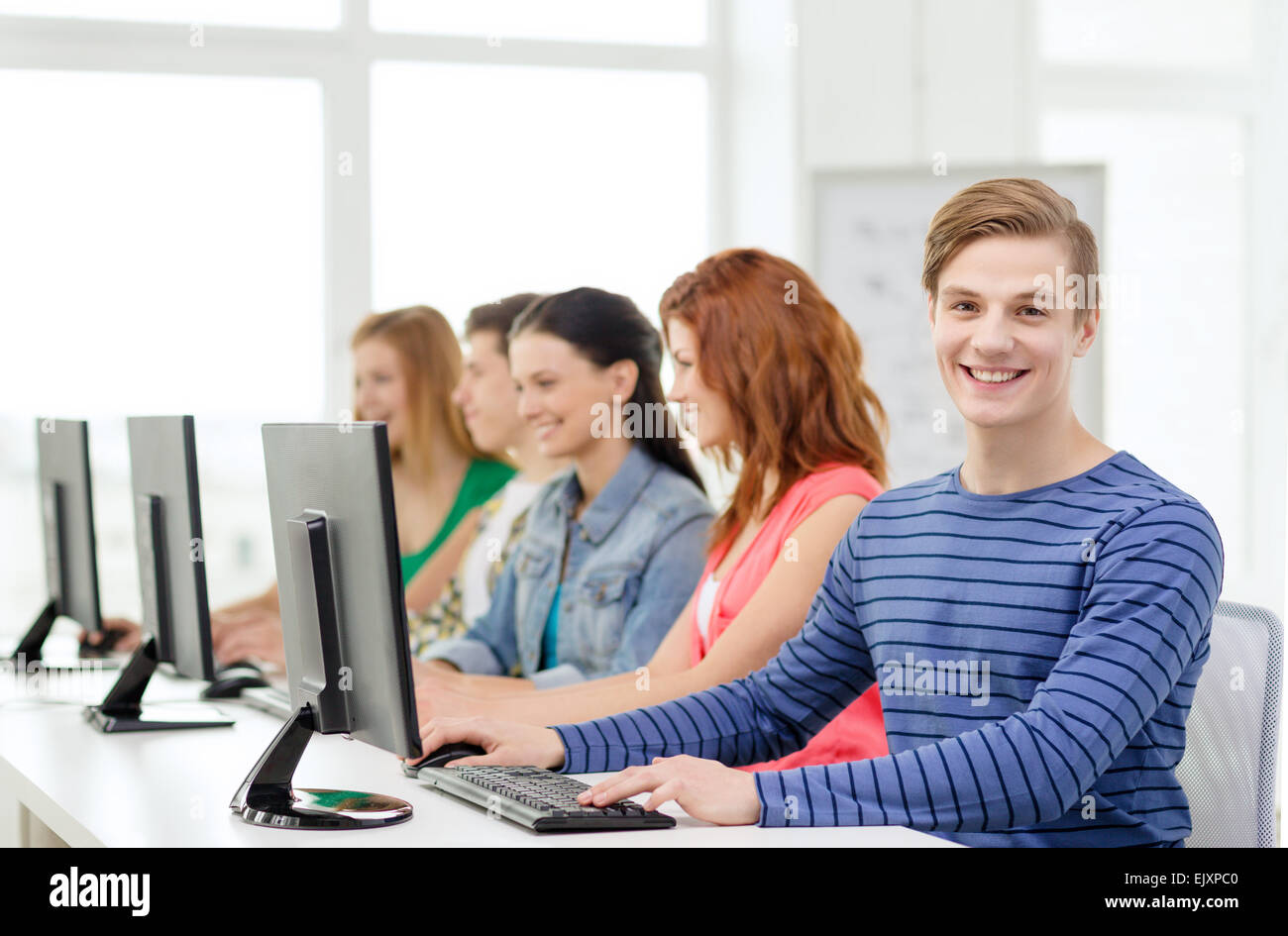 male student with classmates in computer class Stock Photo - Alamy