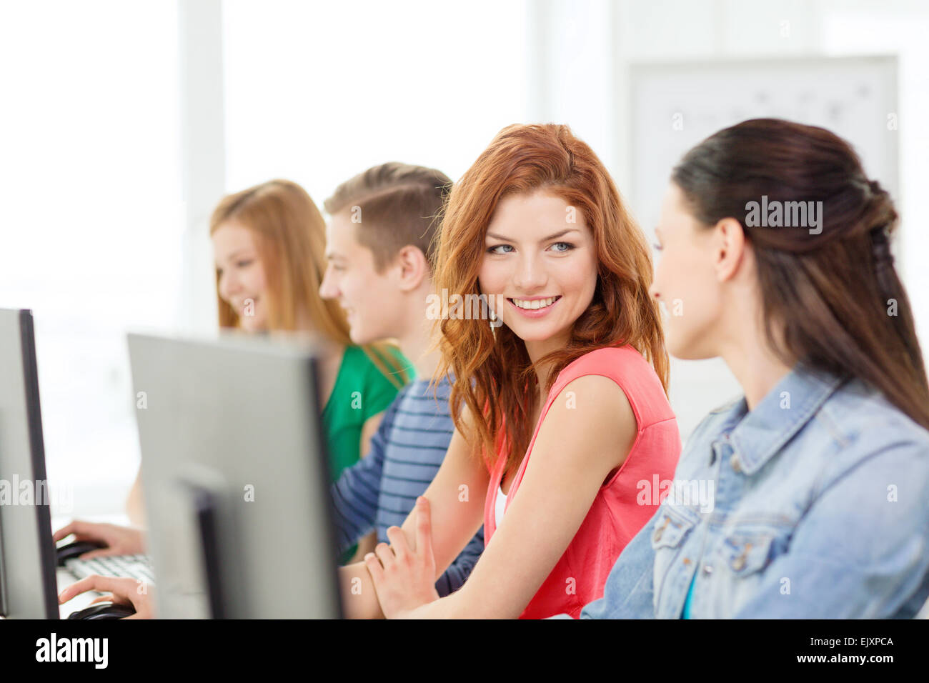 smiling students in computer class at school Stock Photo - Alamy