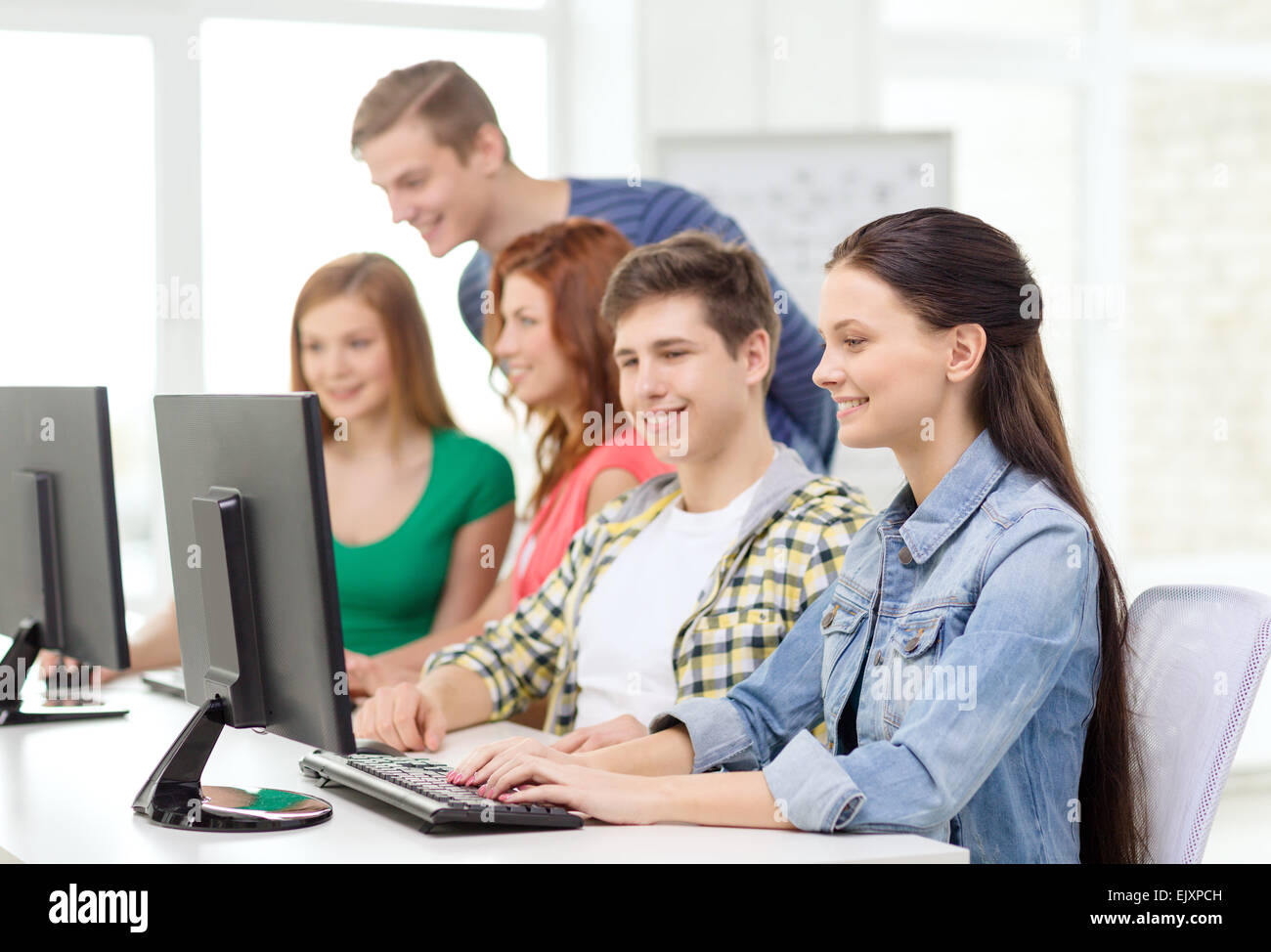 female student with classmates in computer class Stock Photo - Alamy