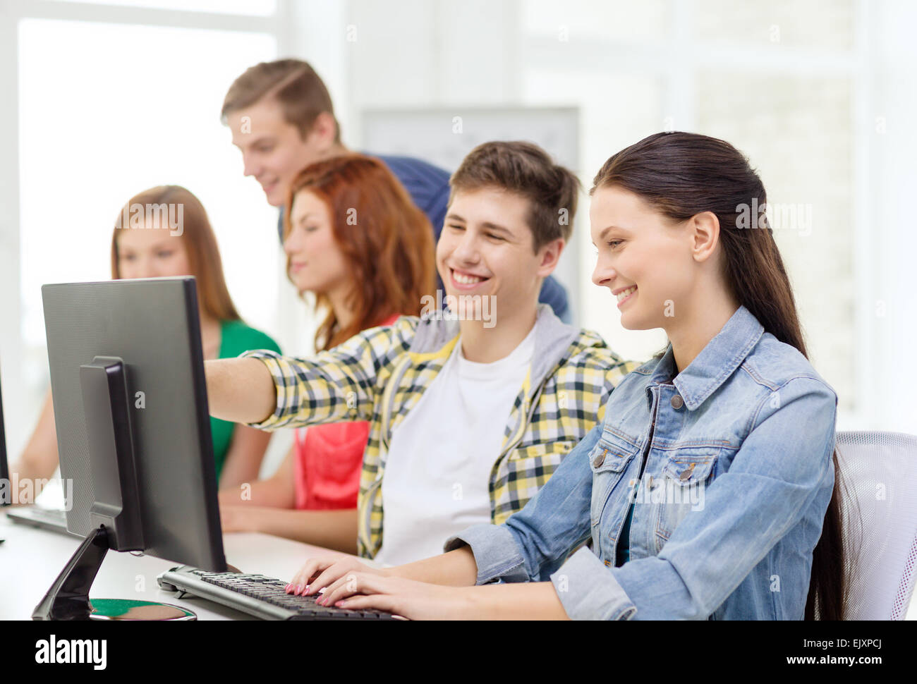 female student with classmates in computer class Stock Photo - Alamy