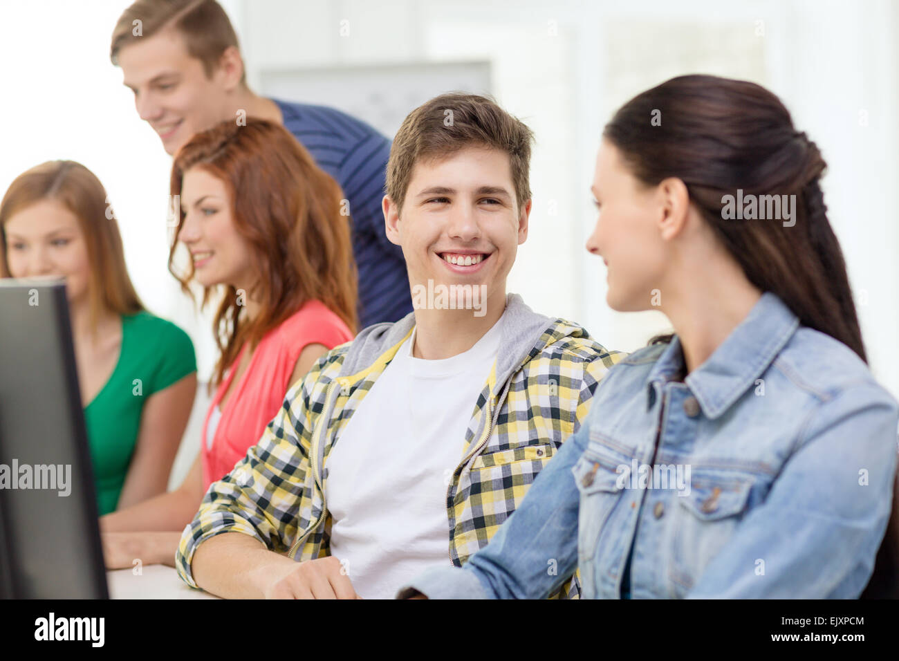 smiling students in computer class at school Stock Photo - Alamy