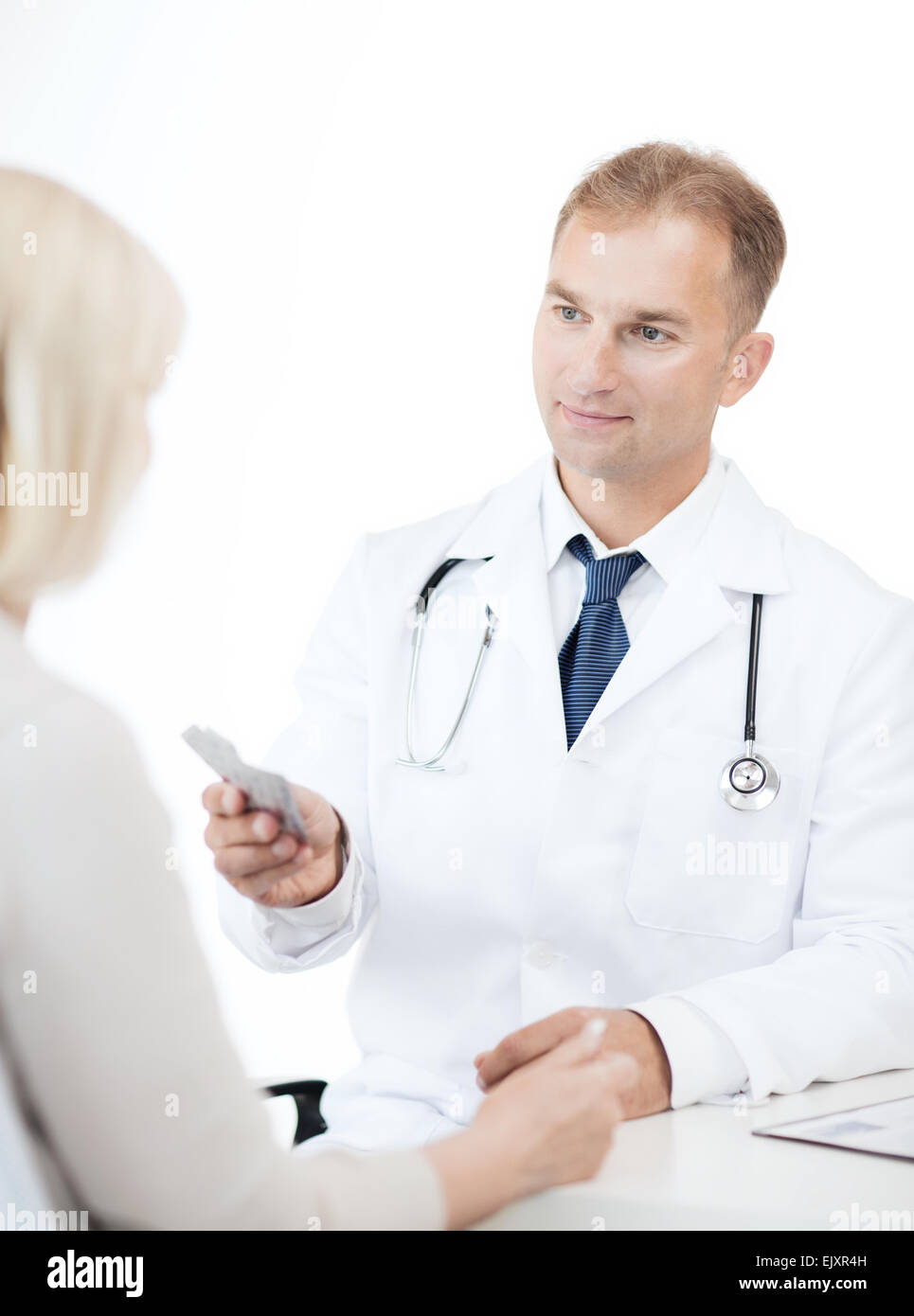 doctor giving tablets to patient in hospital Stock Photo - Alamy