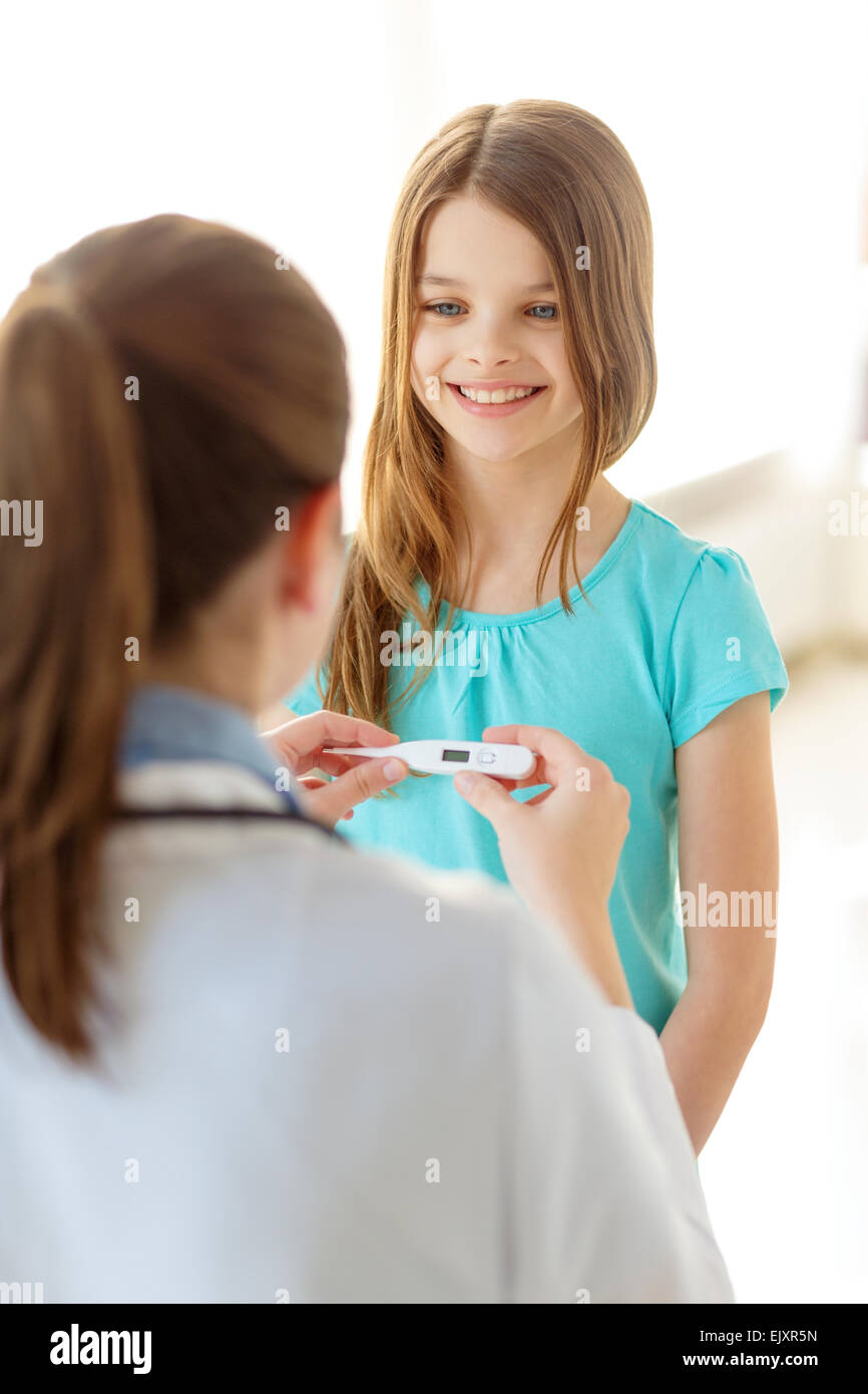 female doctor with child measuring temperature Stock Photo - Alamy