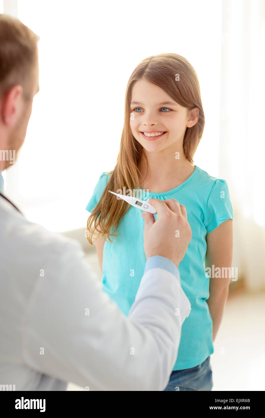 male doctor with child measuring temperature Stock Photo - Alamy