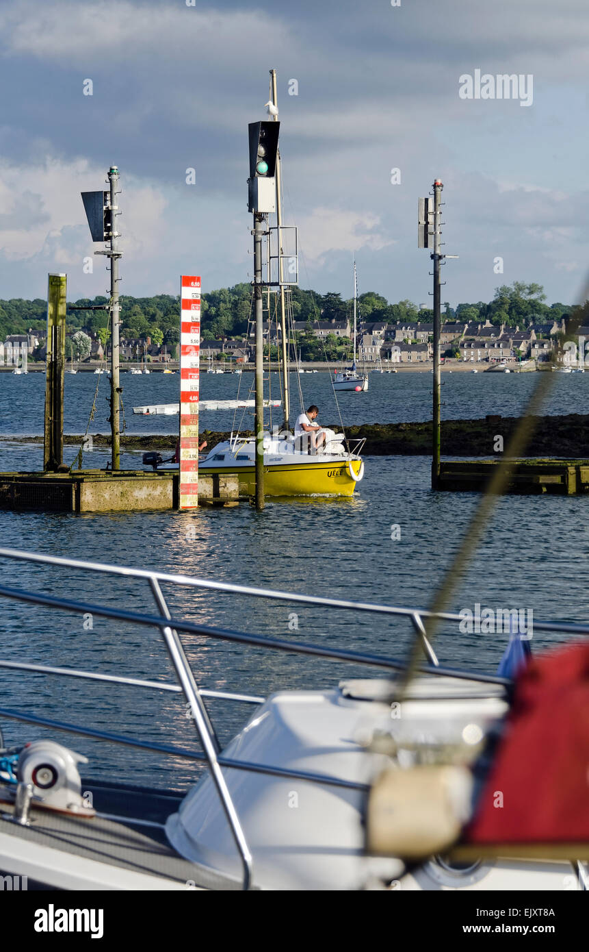 Sailing boat entering Plouer sur Rance marina entrance sill with tide ...