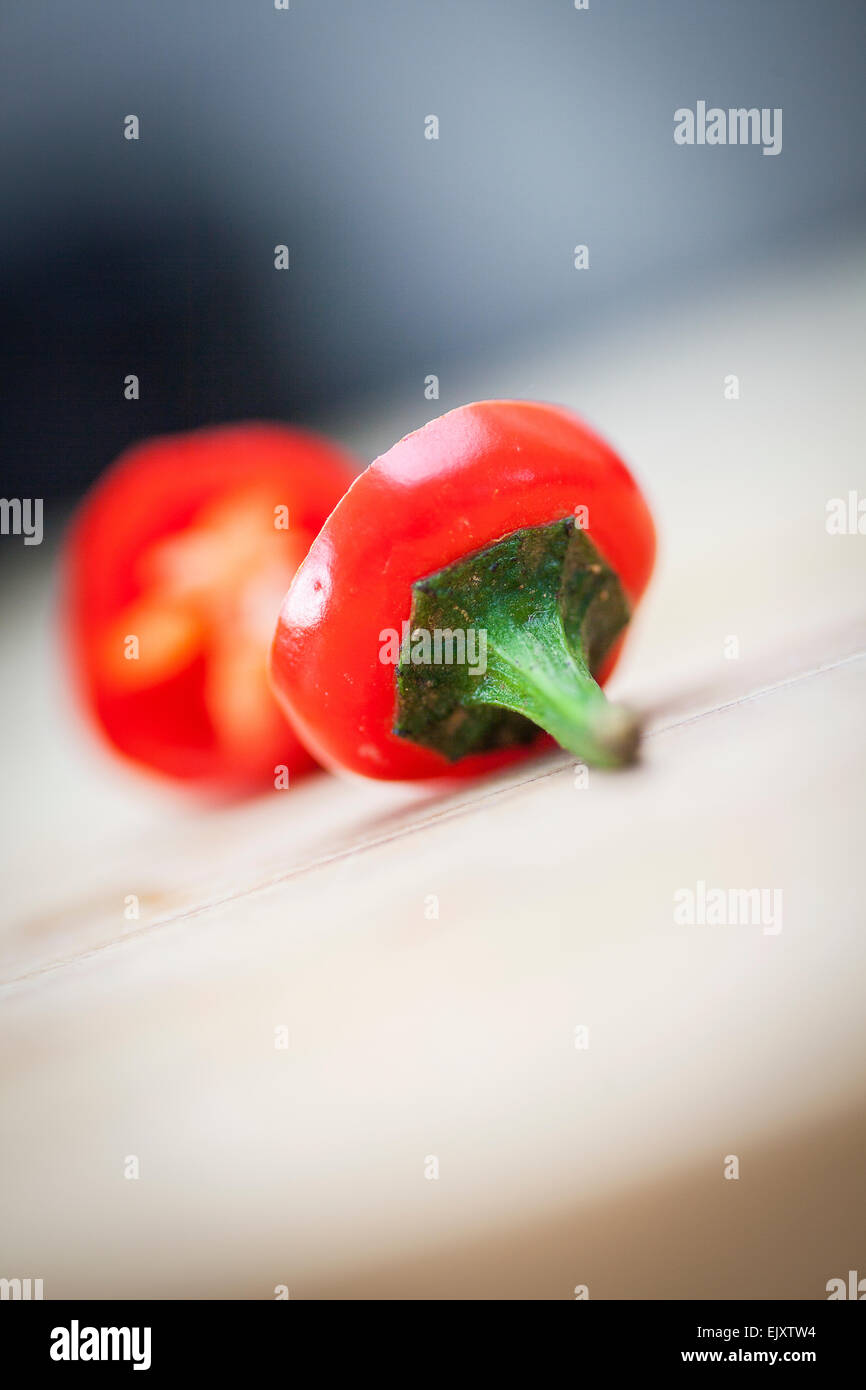 Red chilli pepper cut through the middle with the seeds showing Stock ...