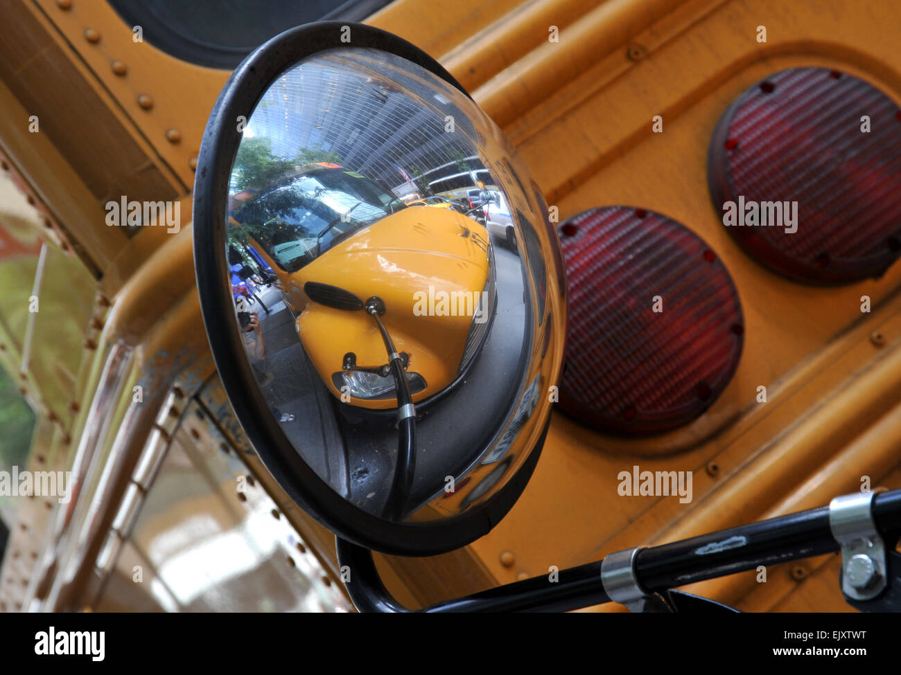 Yellow school bus reflection, New York City, USA Stock Photo - Alamy