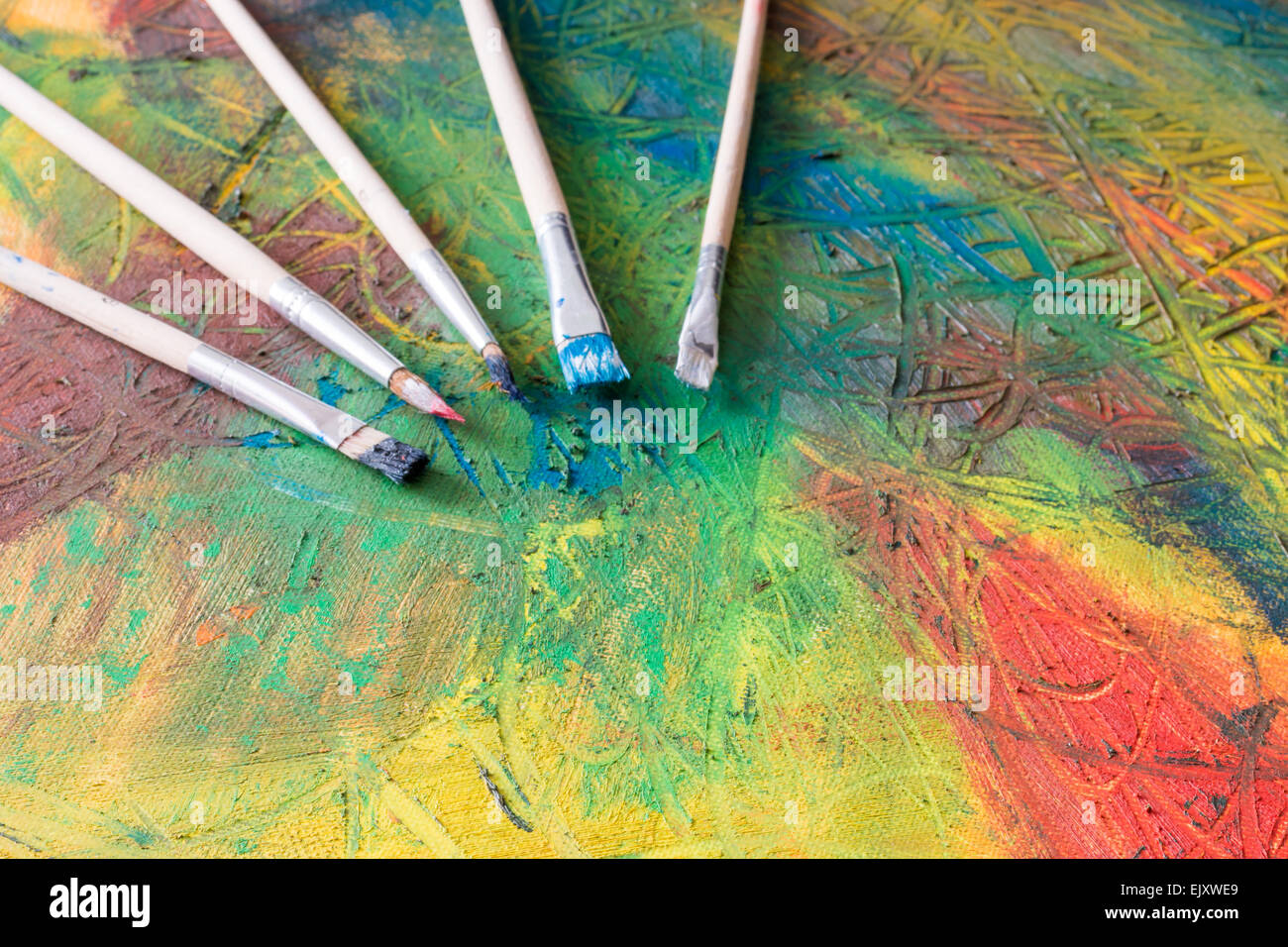 Painting of abstract painting with paintbrushes Stock Photo - Alamy