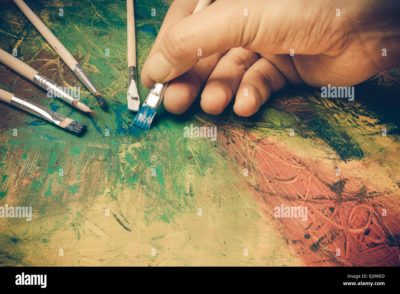 Painting of abstract painting with paintbrushes Stock Photo - Alamy
