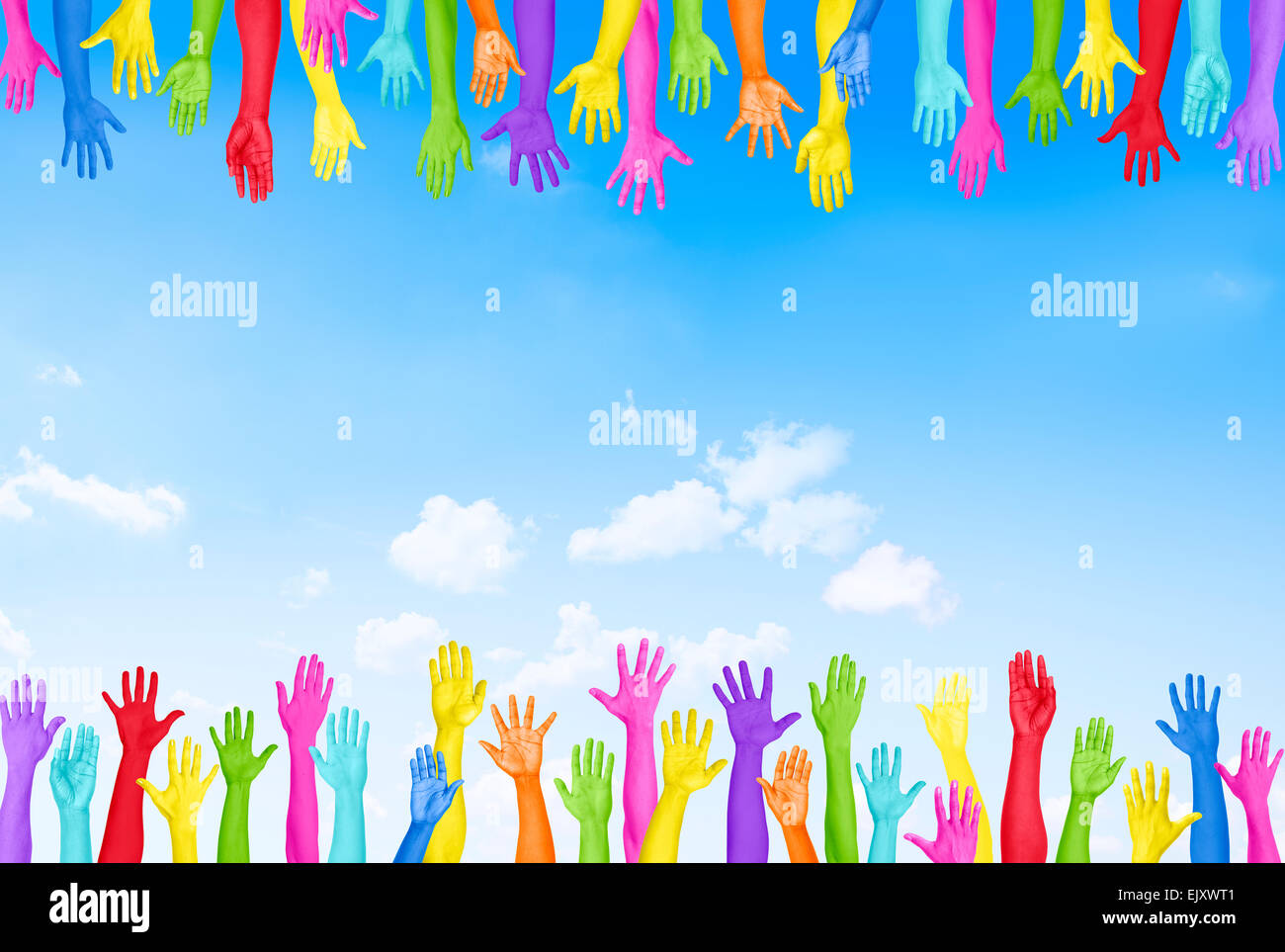 Colorful Hands Raised With Blue Sky Stock Photo - Alamy