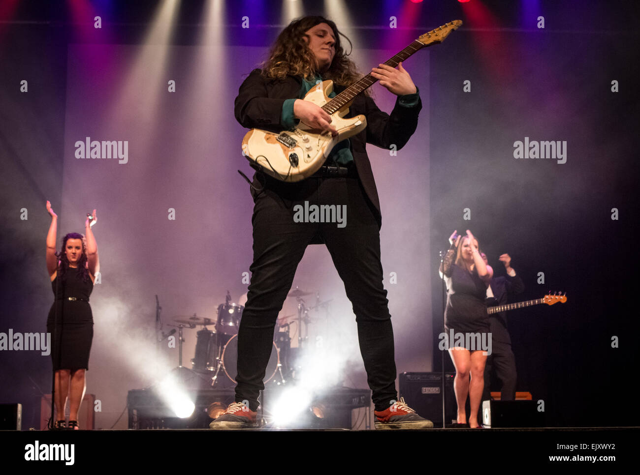Rock performers live on stage in a theatre Stock Photo - Alamy