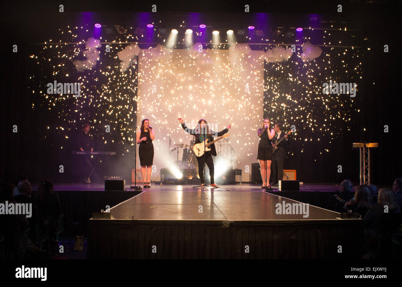 Fireworks set off at the end of a concert showing the whole band before ...