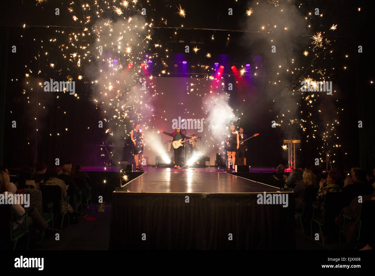 Rock performers live on stage in a theatre Stock Photo - Alamy