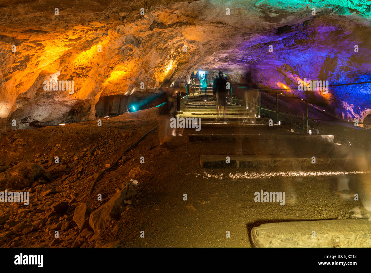 Jerusalem, Israel. People go down the colorfully lit Zedekiah’s Cave ...