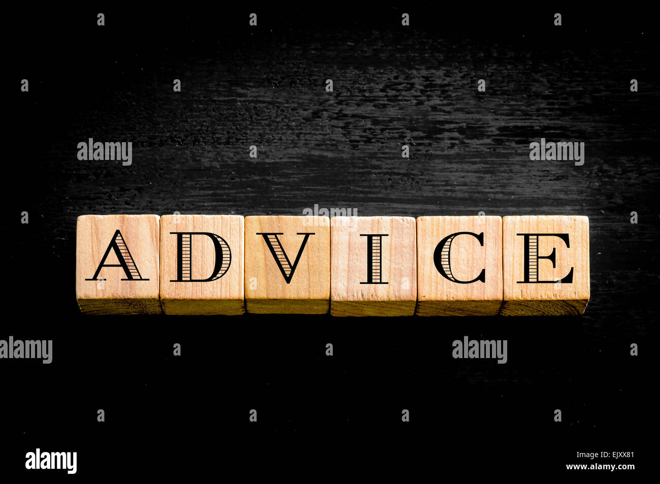 Word Advice. Wooden small cubes with letters isolated on black ...