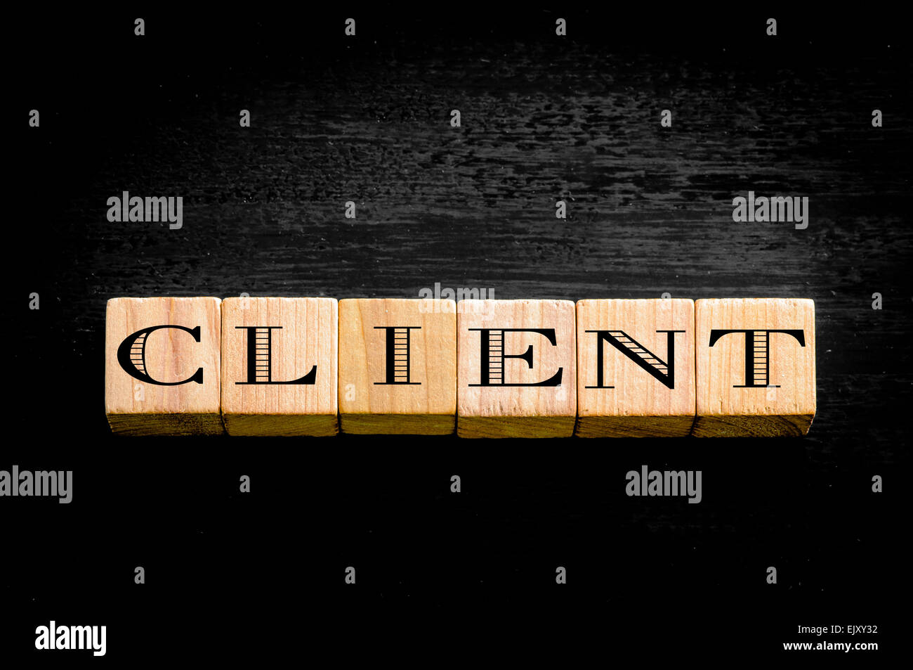 Word Client. Wooden small cubes with letters isolated on black ...