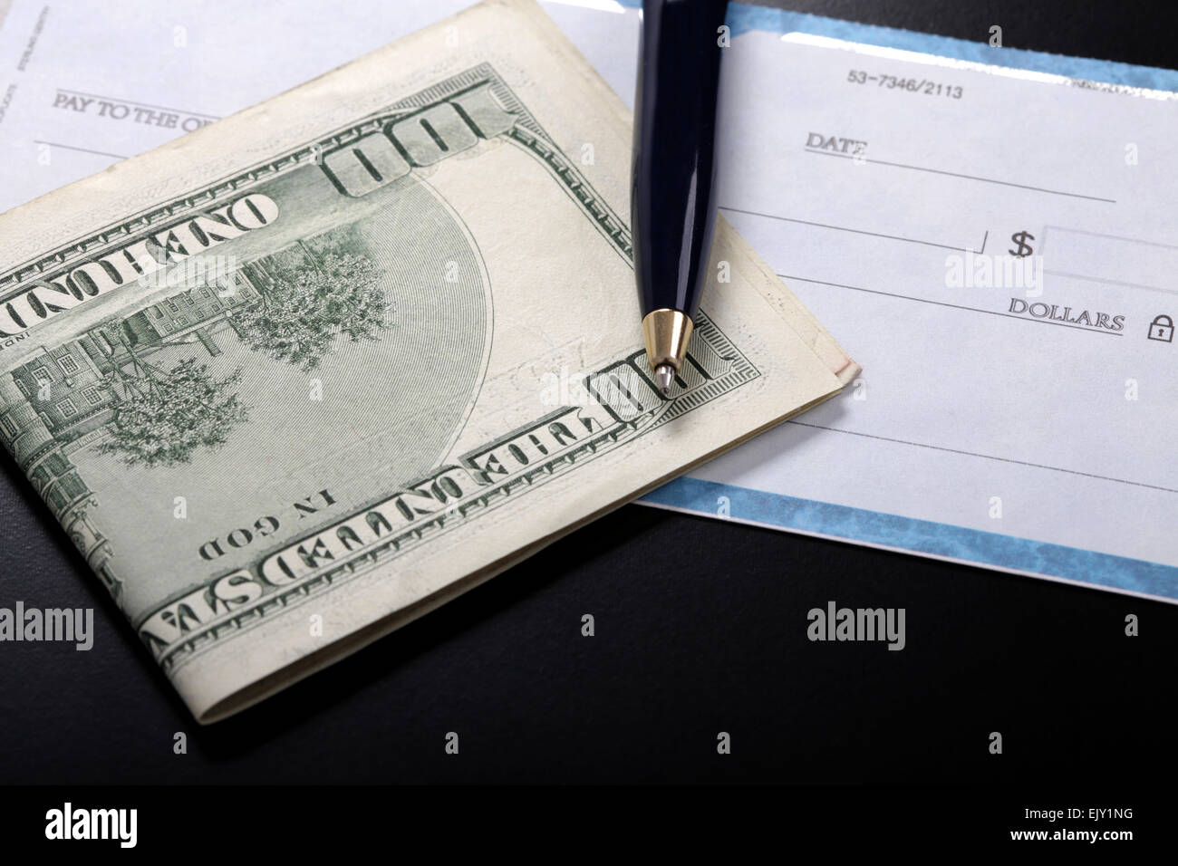 Check and money Stock Photo - Alamy