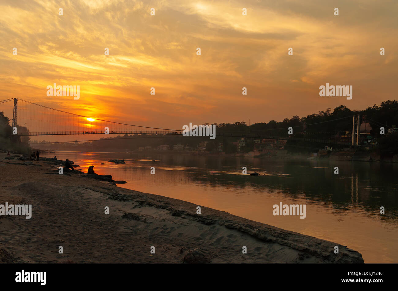 View of River Ganga and Ram Jhula bridge at sunset. Rishikesh. India ...