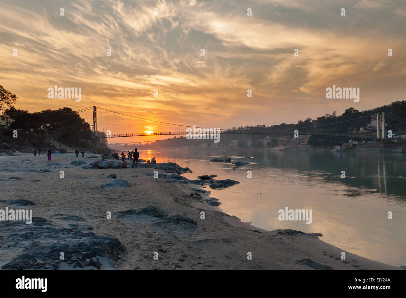 View of River Ganga and Ram Jhula bridge at sunset. Rishikesh. India ...