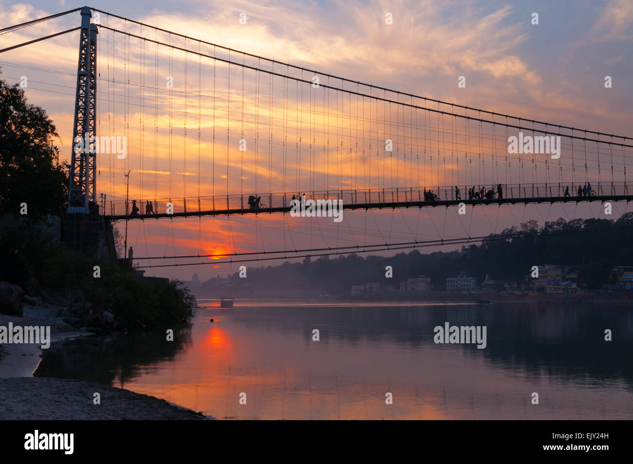 View of River Ganga and Ram Jhula bridge at sunset. Rishikesh. India ...