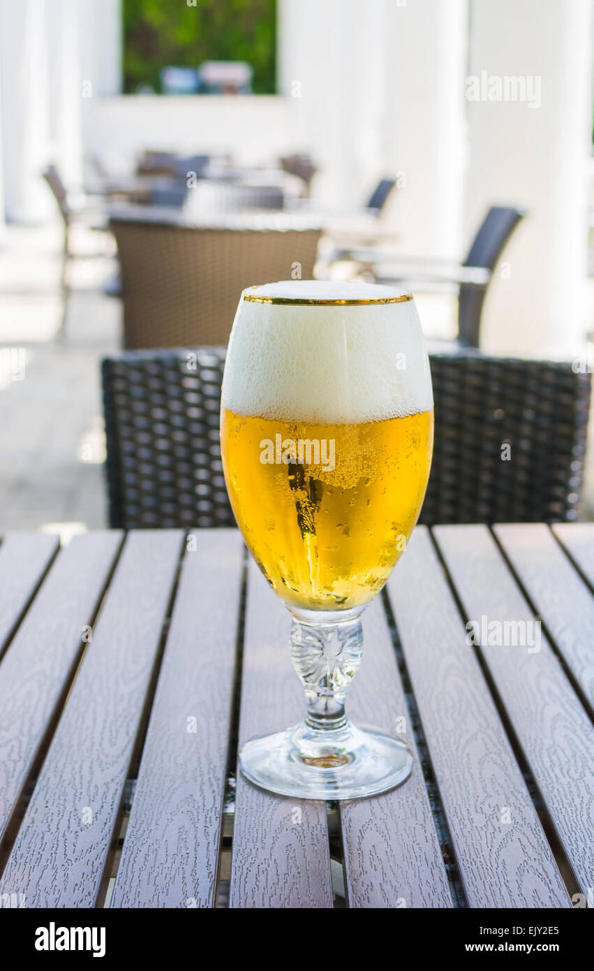 Glass of beer is waiting for the first visitor Stock Photo - Alamy