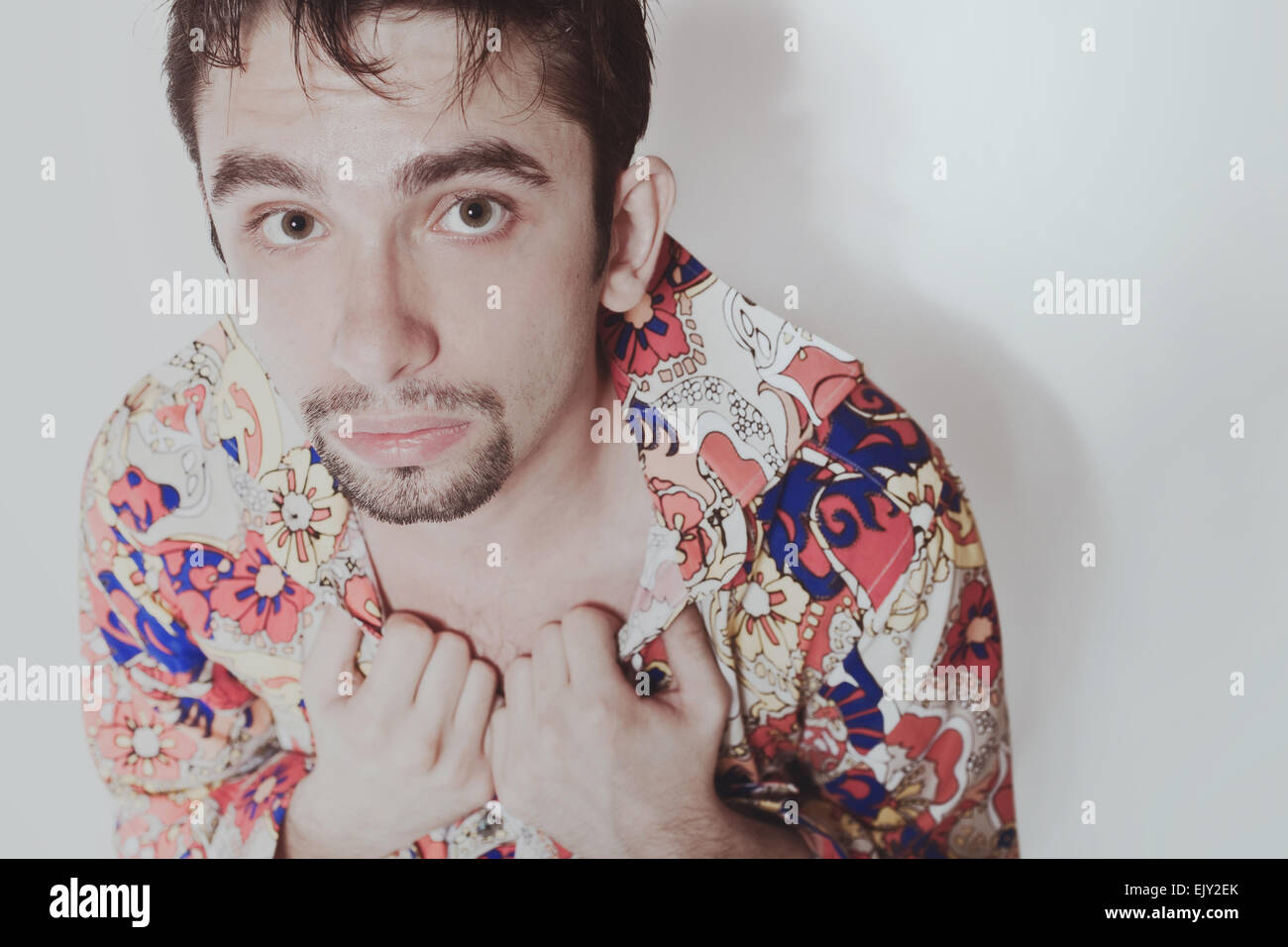 Portrait of a young shy man on a white background Stock Photo - Alamy