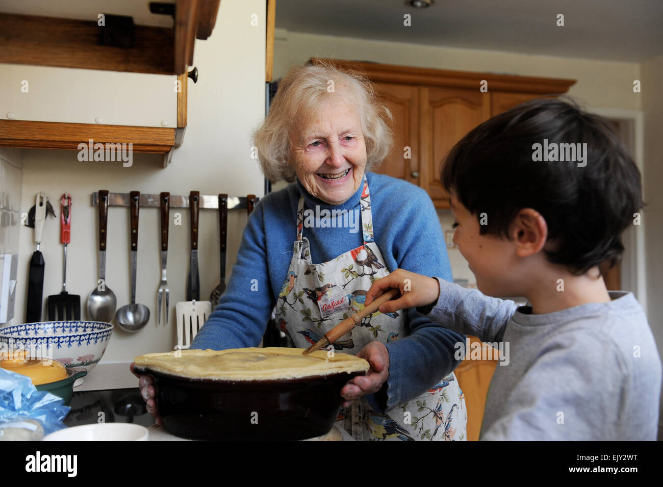 grandmother and grandson cooking in the kitchen Stock Photo - Alamy