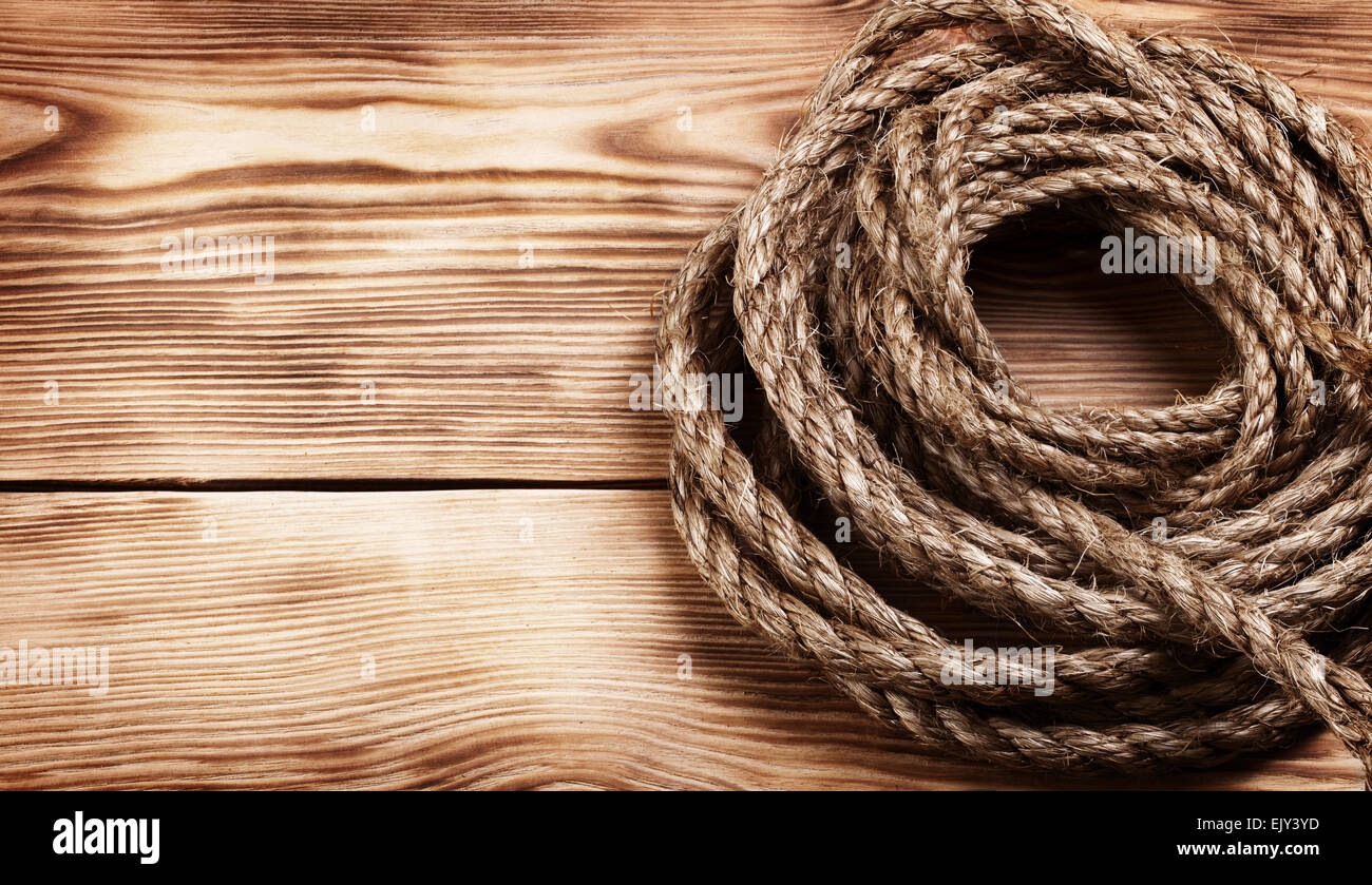 old rope on wooden boards for your design Stock Photo - Alamy