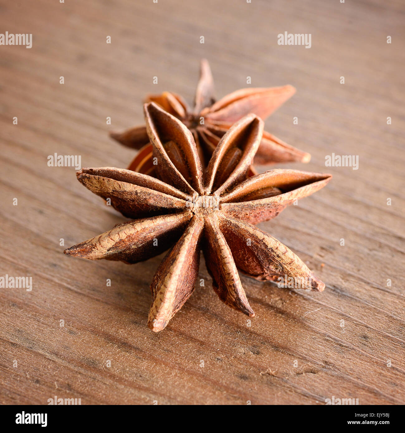 Star anise over the brown wooden table Stock Photo - Alamy