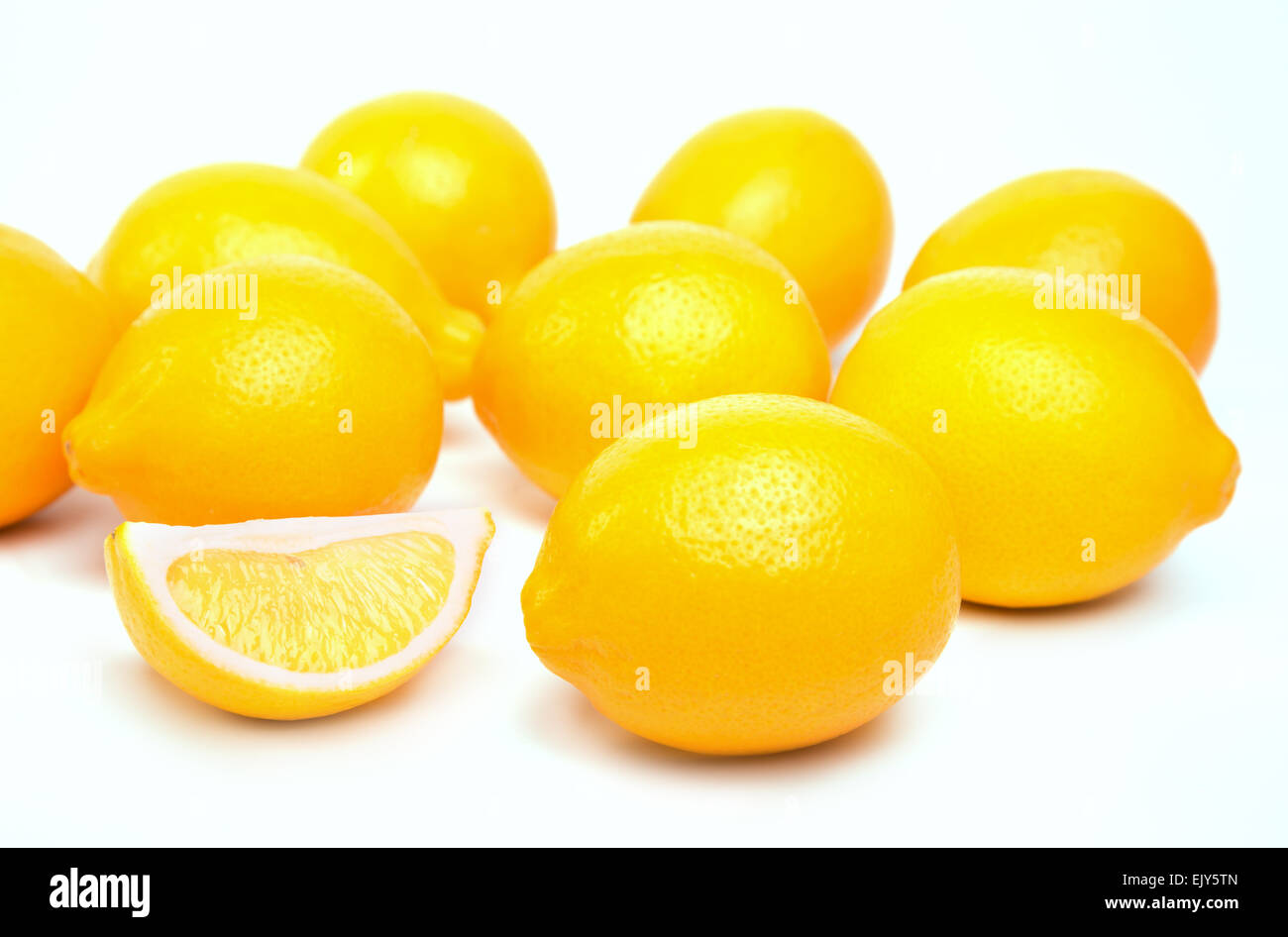 ripe lemons on a white background Stock Photo - Alamy