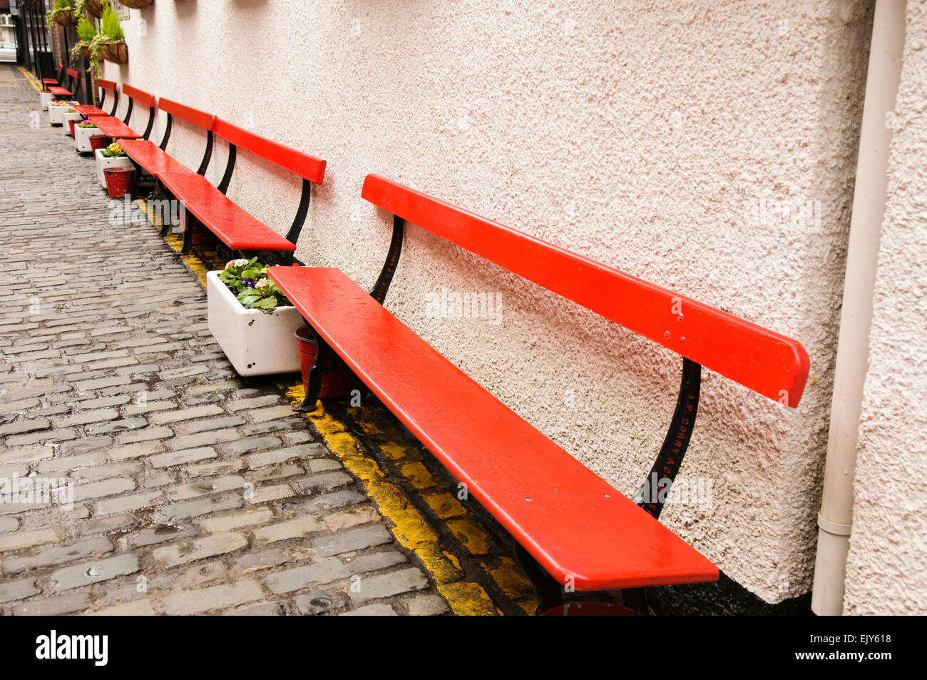Red benches outside the Duke of York bar in Belfast Stock Photo - Alamy