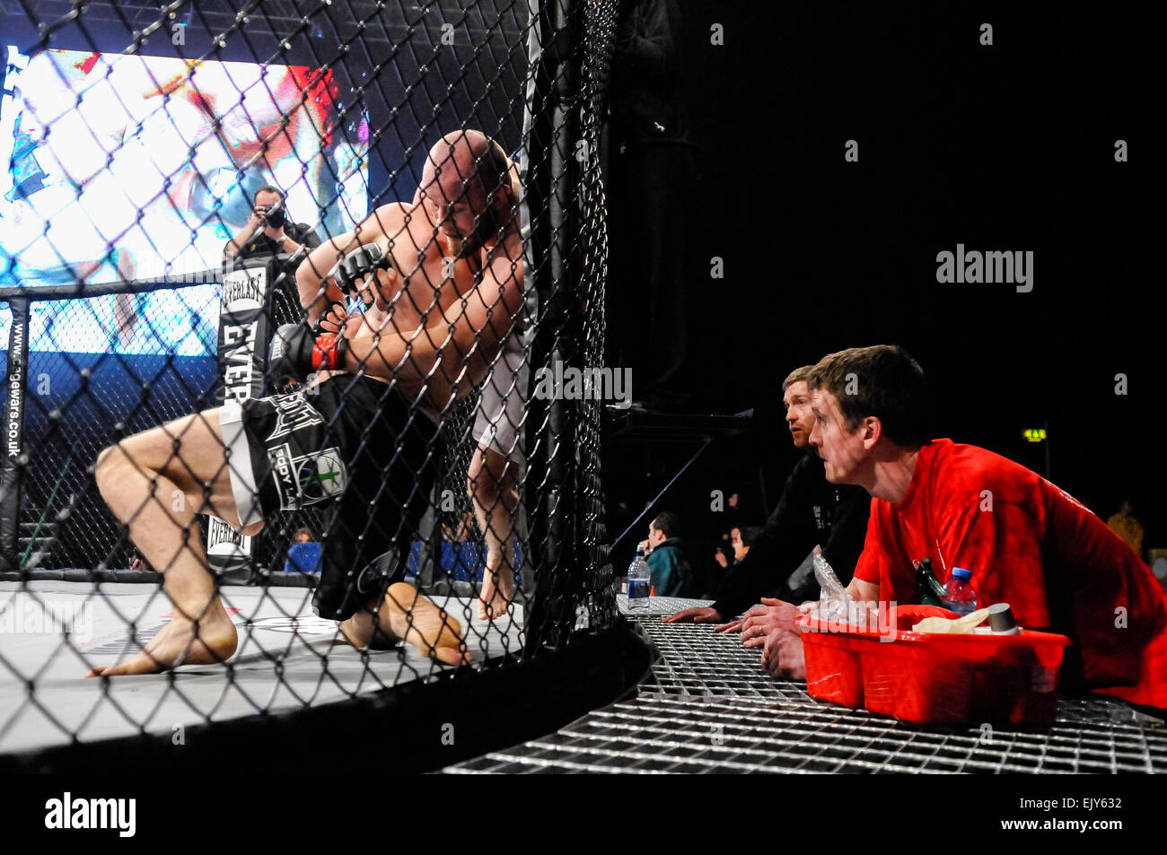 Coach gives instructions to a cage fighter during a fight Stock Photo ...