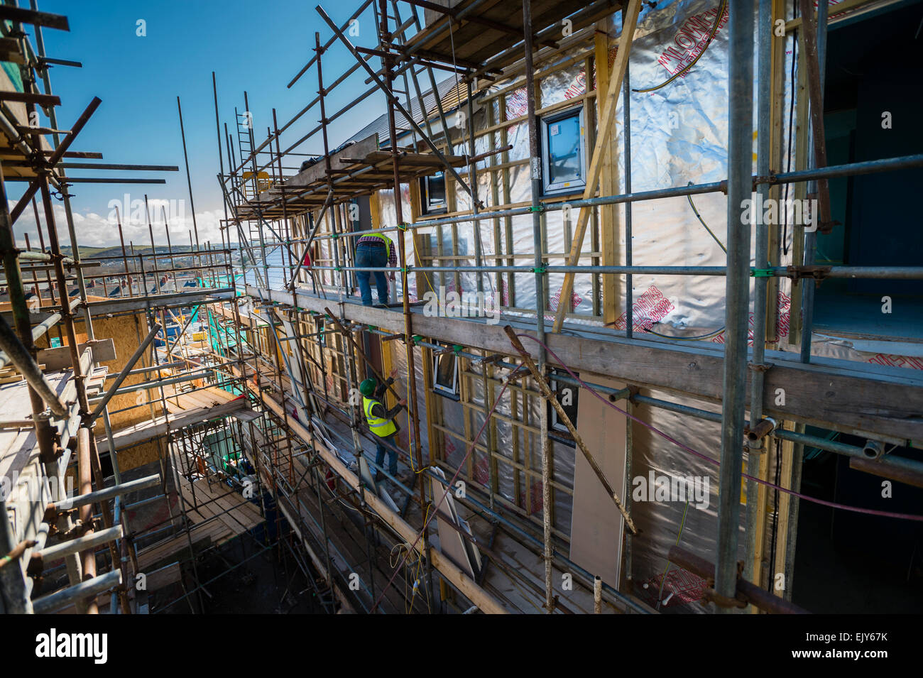 Construction worker / building site: workers on site building new ...