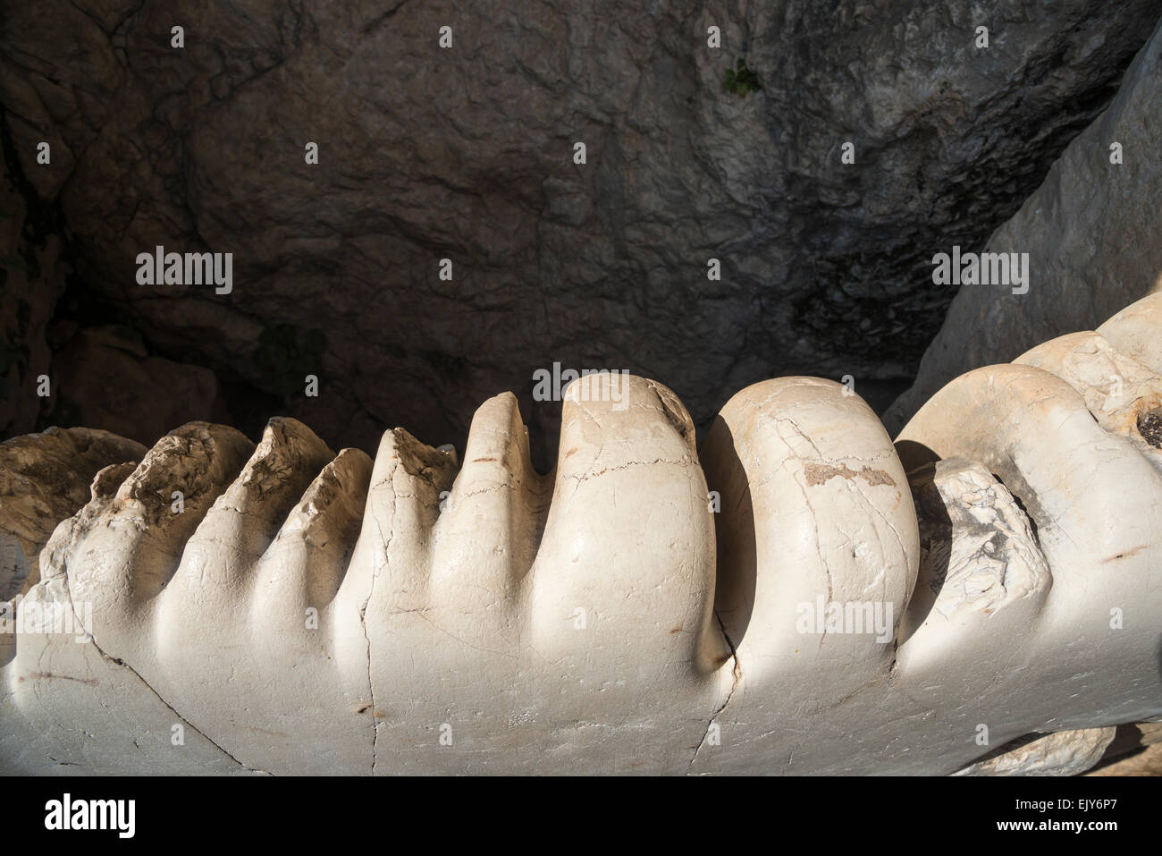 Rope marks worn into the marble covering to an ancient well at the ...