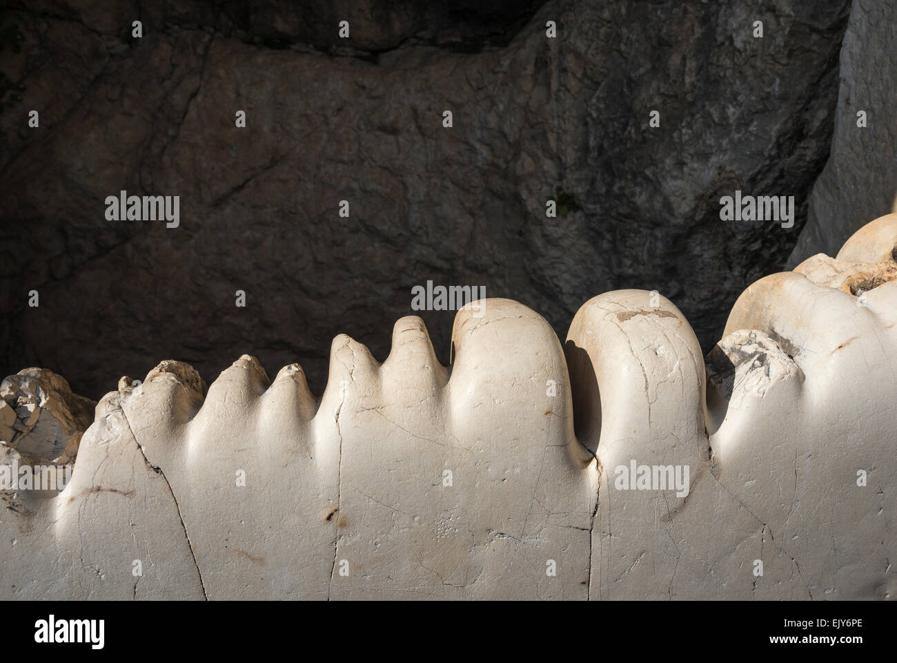 Rope marks worn into the marble covering to an ancient well at the ...