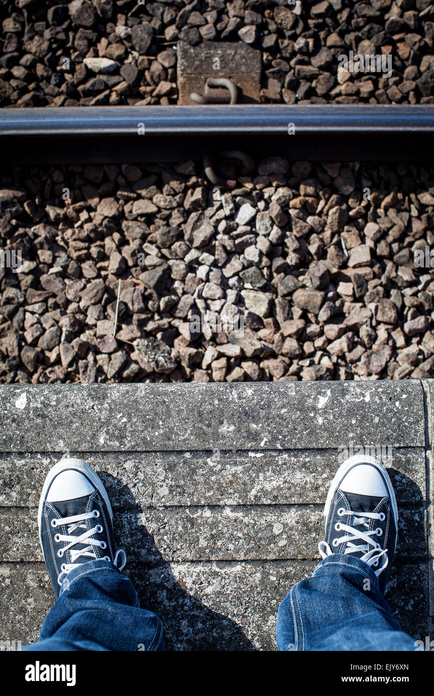 Feet standing on a train platform Stock Photo - Alamy