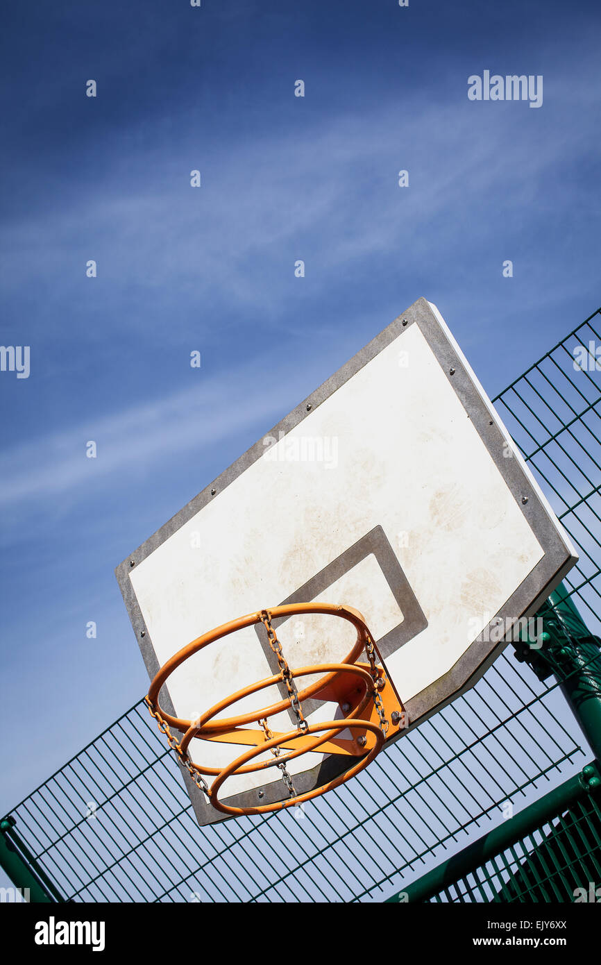 Outdoor basketball net with big blue sky background and space for copy ...