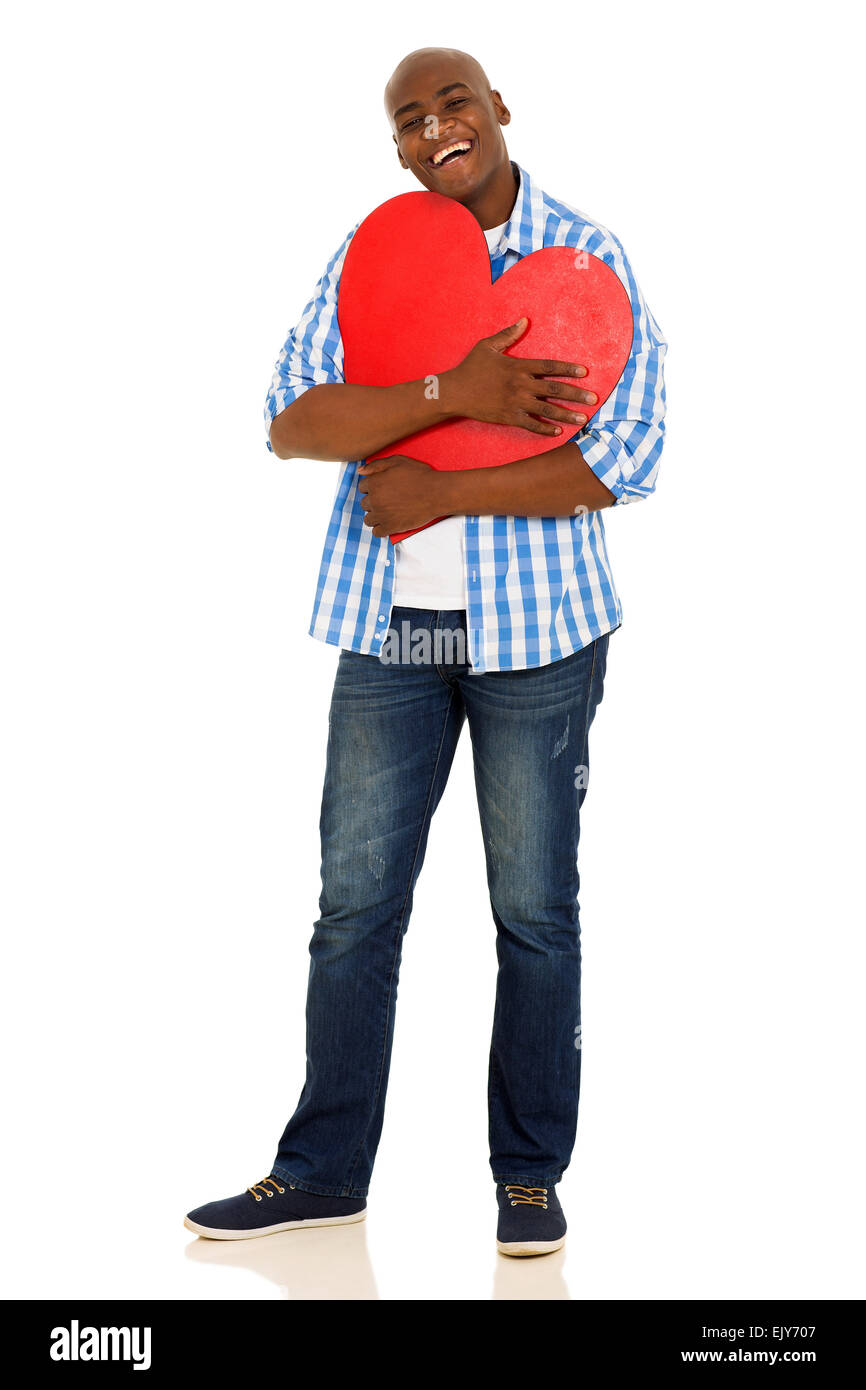 Cheerful African American Man Hugging A Red Heart Shape Isolated On